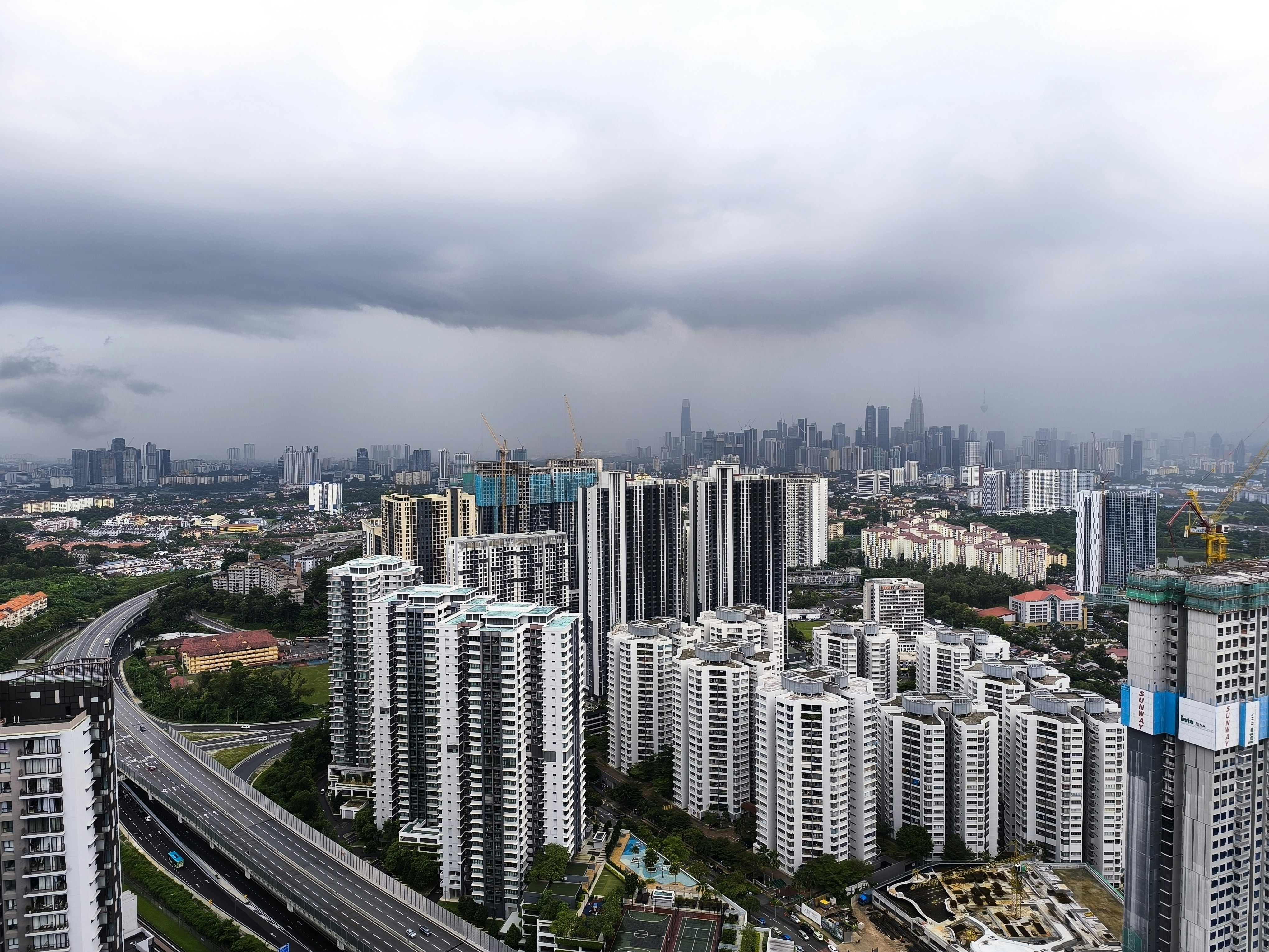 Urban Canyon: A Sea of Towers under a Chest of Stormy Skies