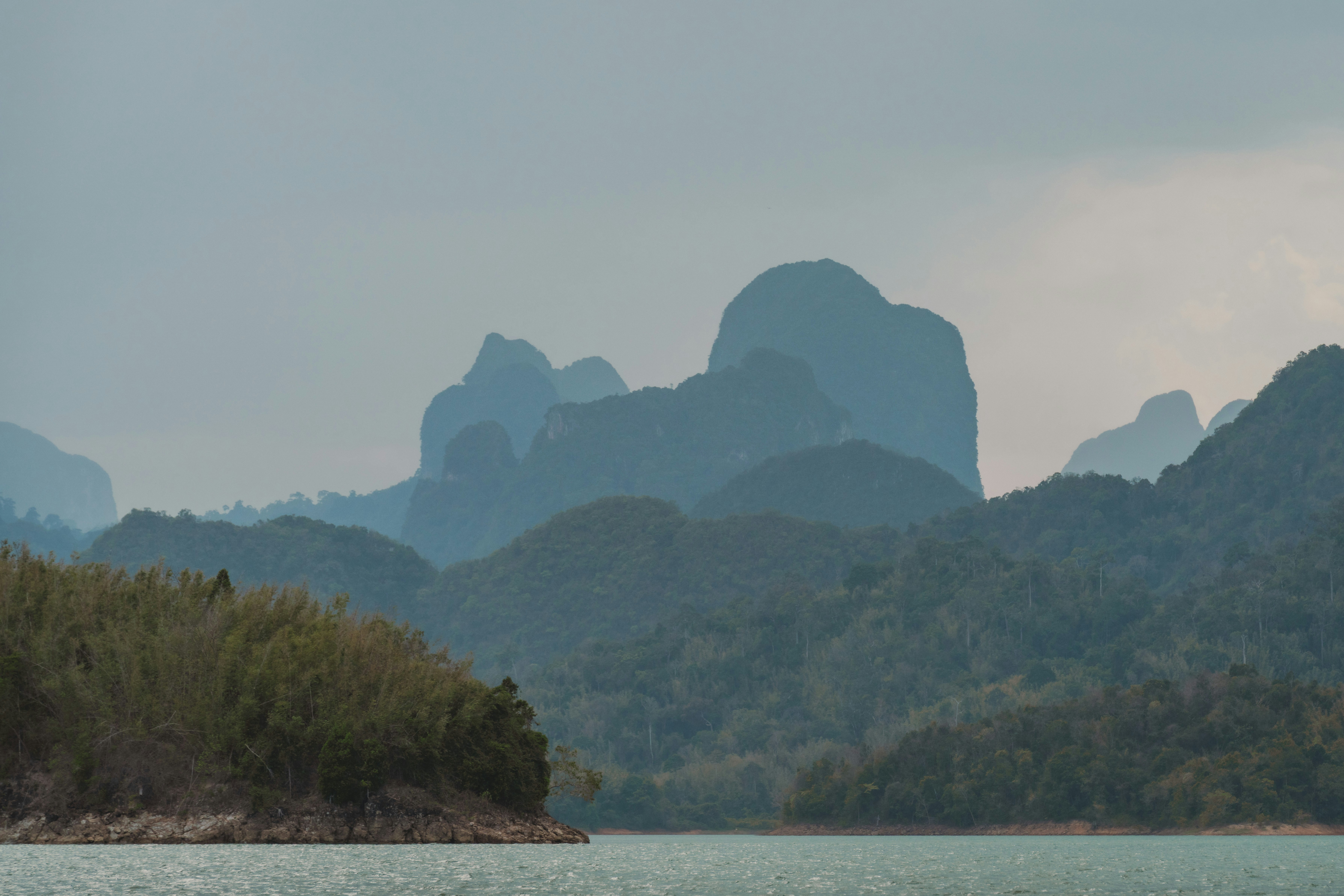Islands of the Mist: Silhouettes Beyond the Quiet Lake