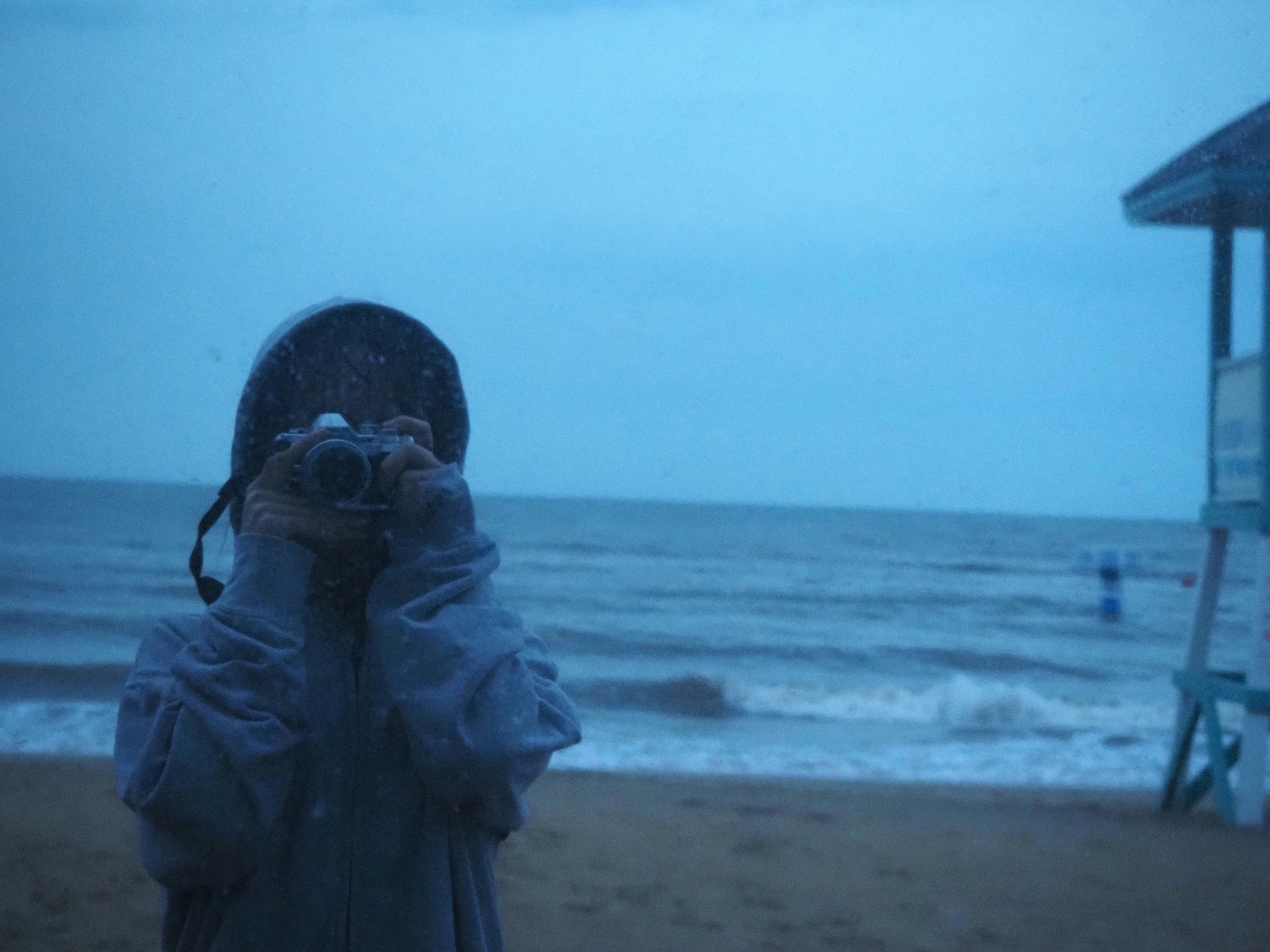 Midday on the Blue-tinged Beach: A Selfie by the Shore