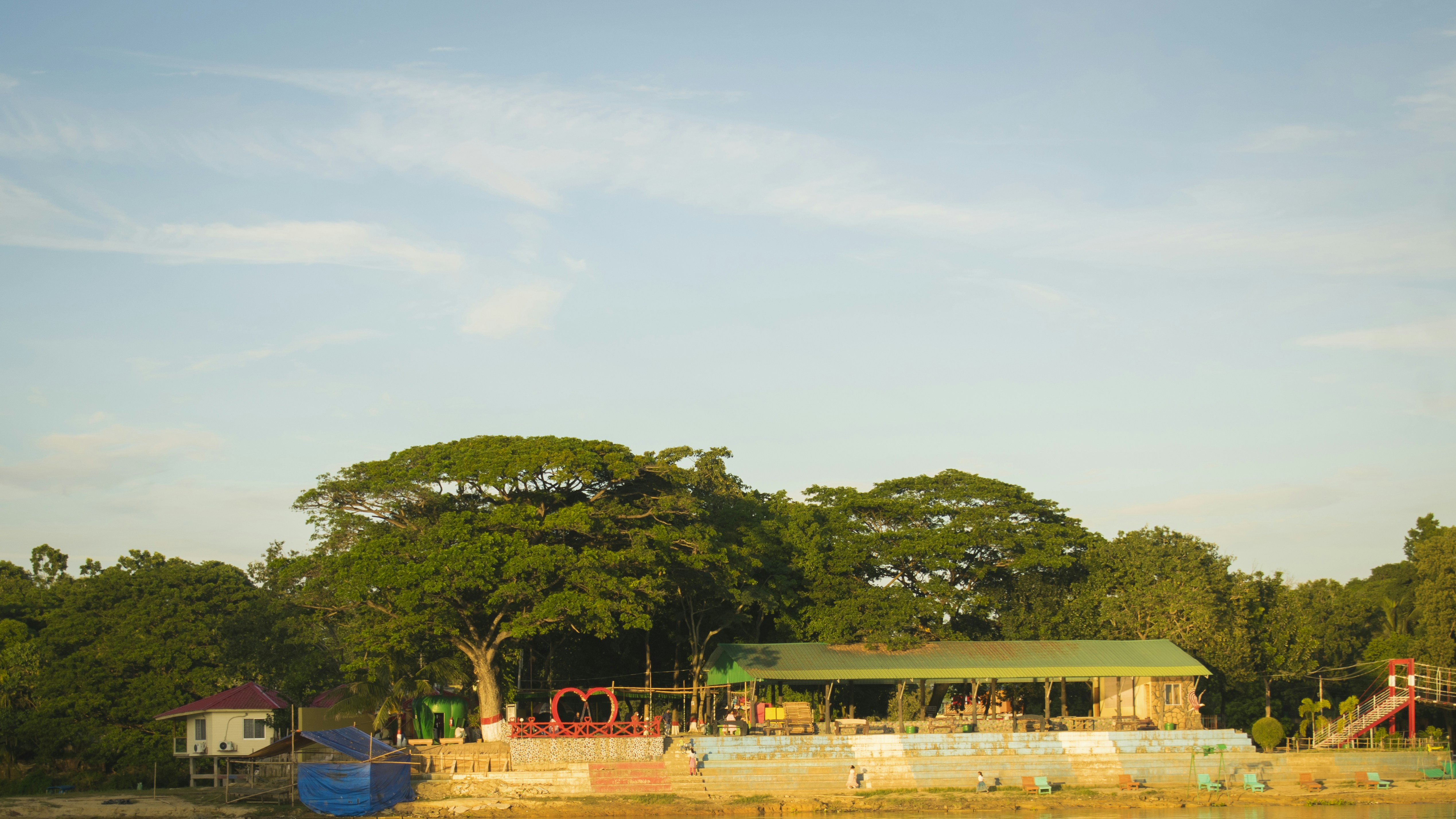 Sunlit Poolside at Dusk: A Quiet Riverside Retreat