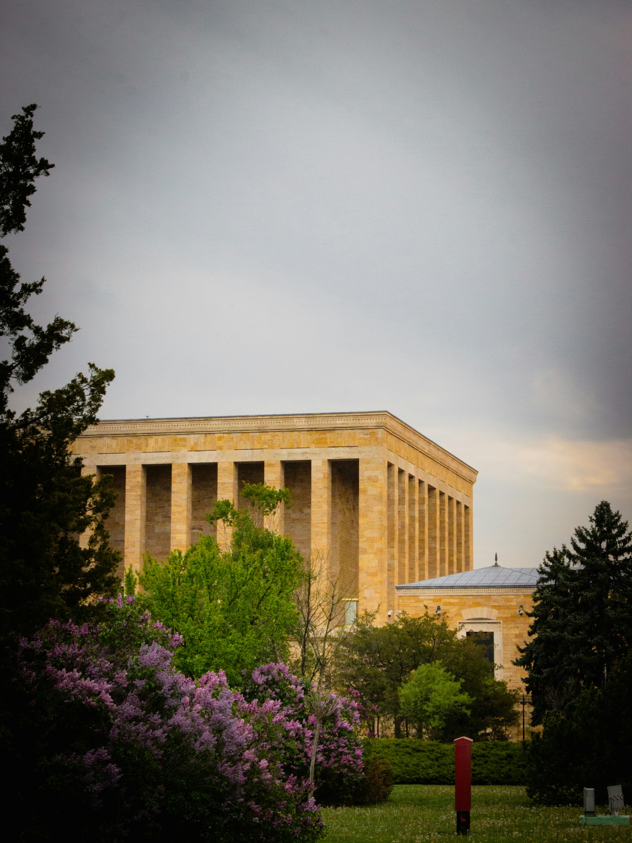 Classical Orthogonals: Stone Facade Framed by Spring Flora