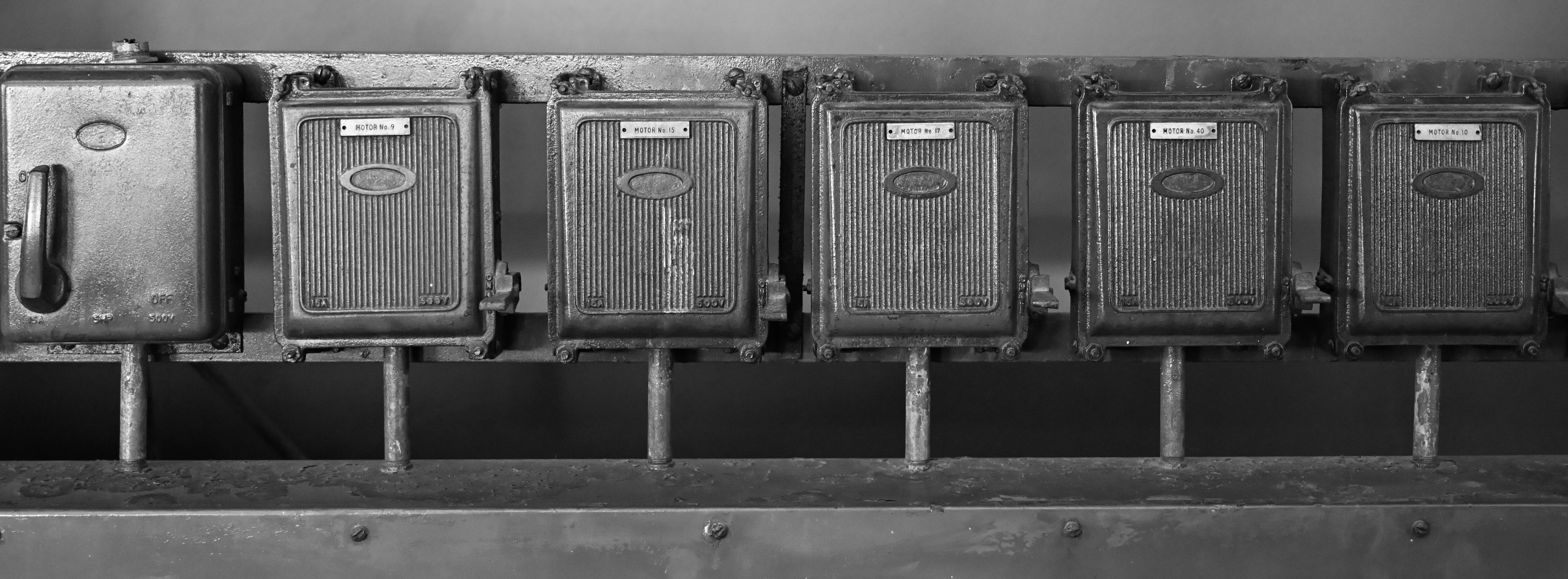 Row of Vintage Magnets: Industrial Repetition in Monochrome