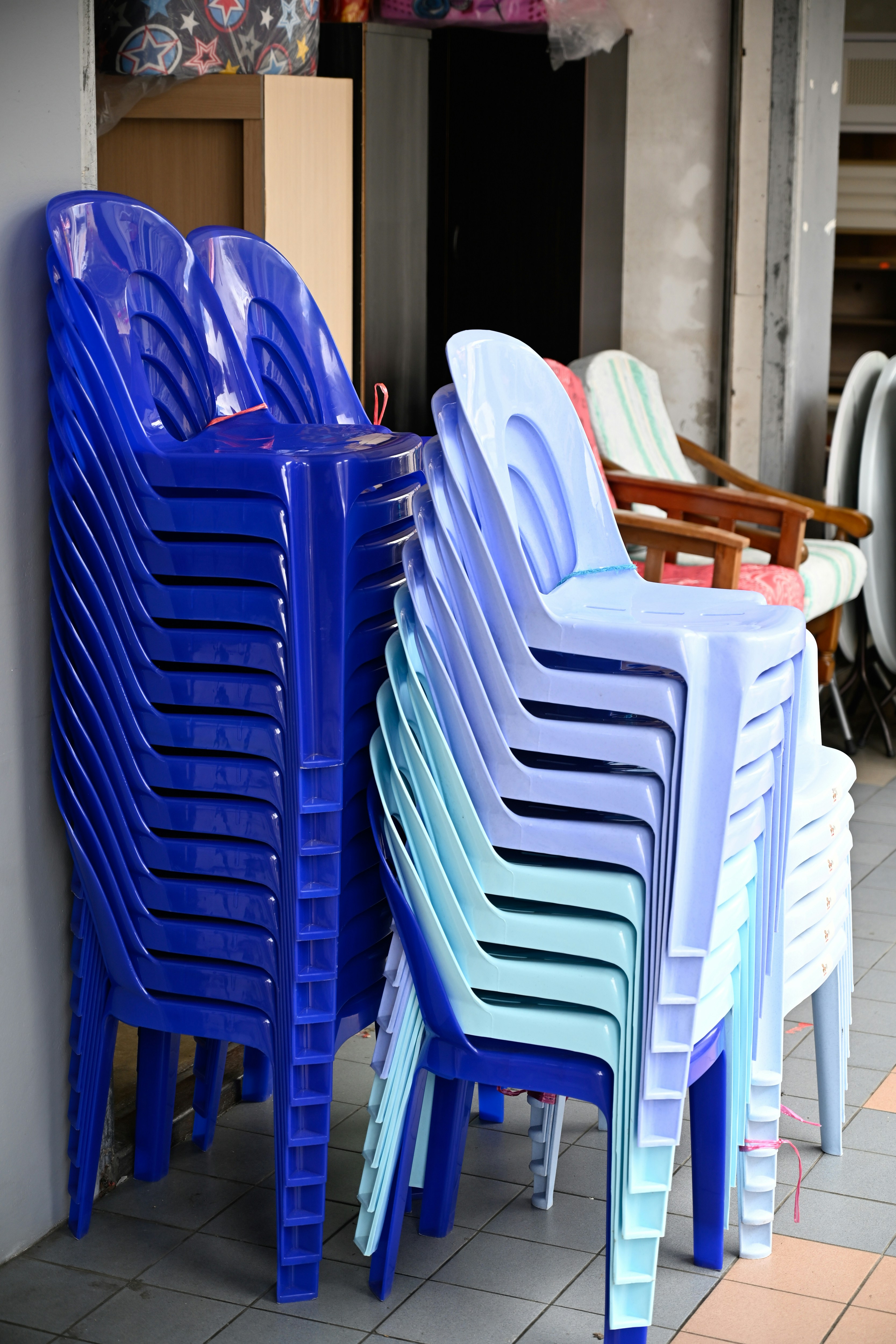 Stacked Blues: A Corridor of Chairs in Quietting Light