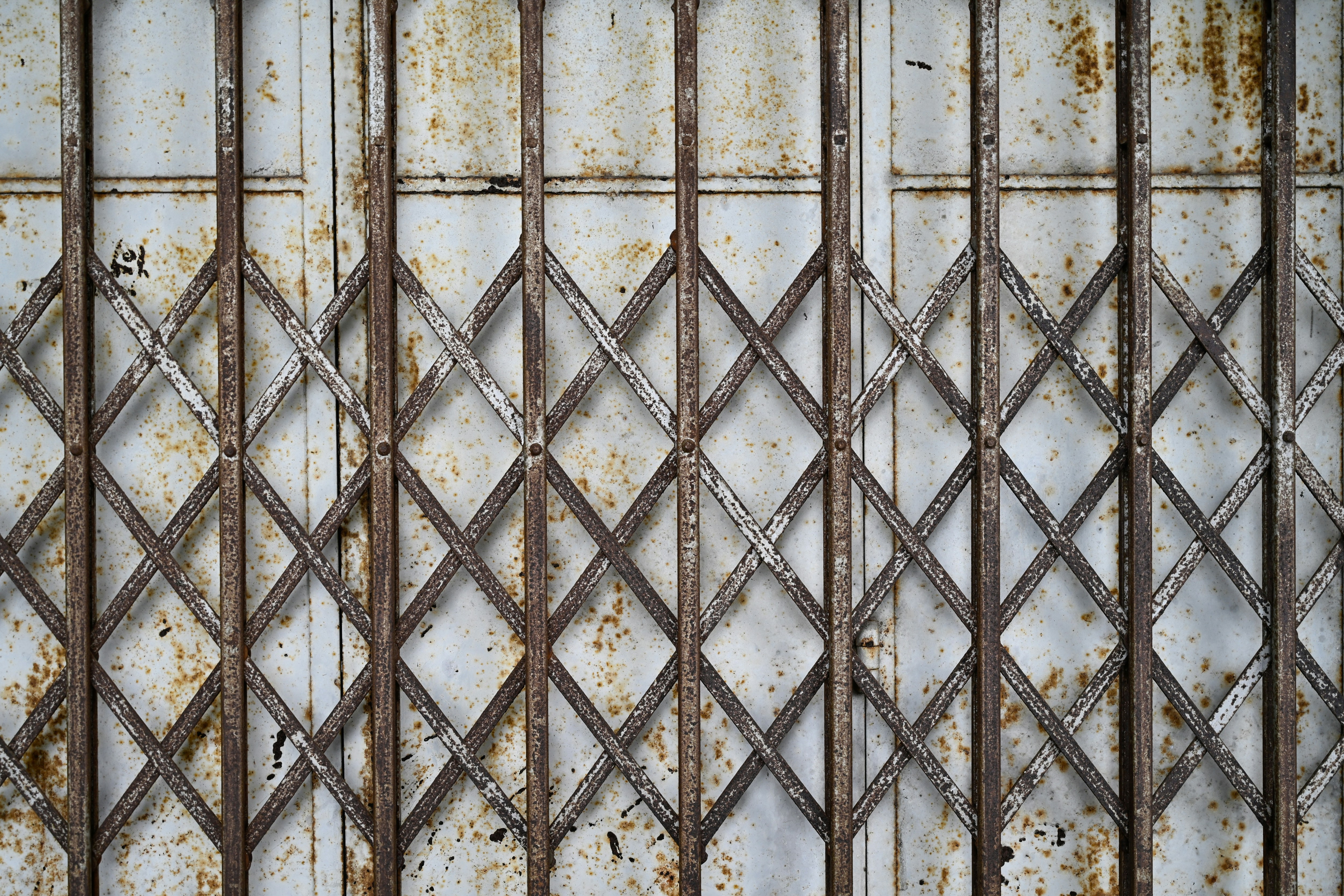Ironwork Grid: Rusted Diamonds on a Weathered Surface