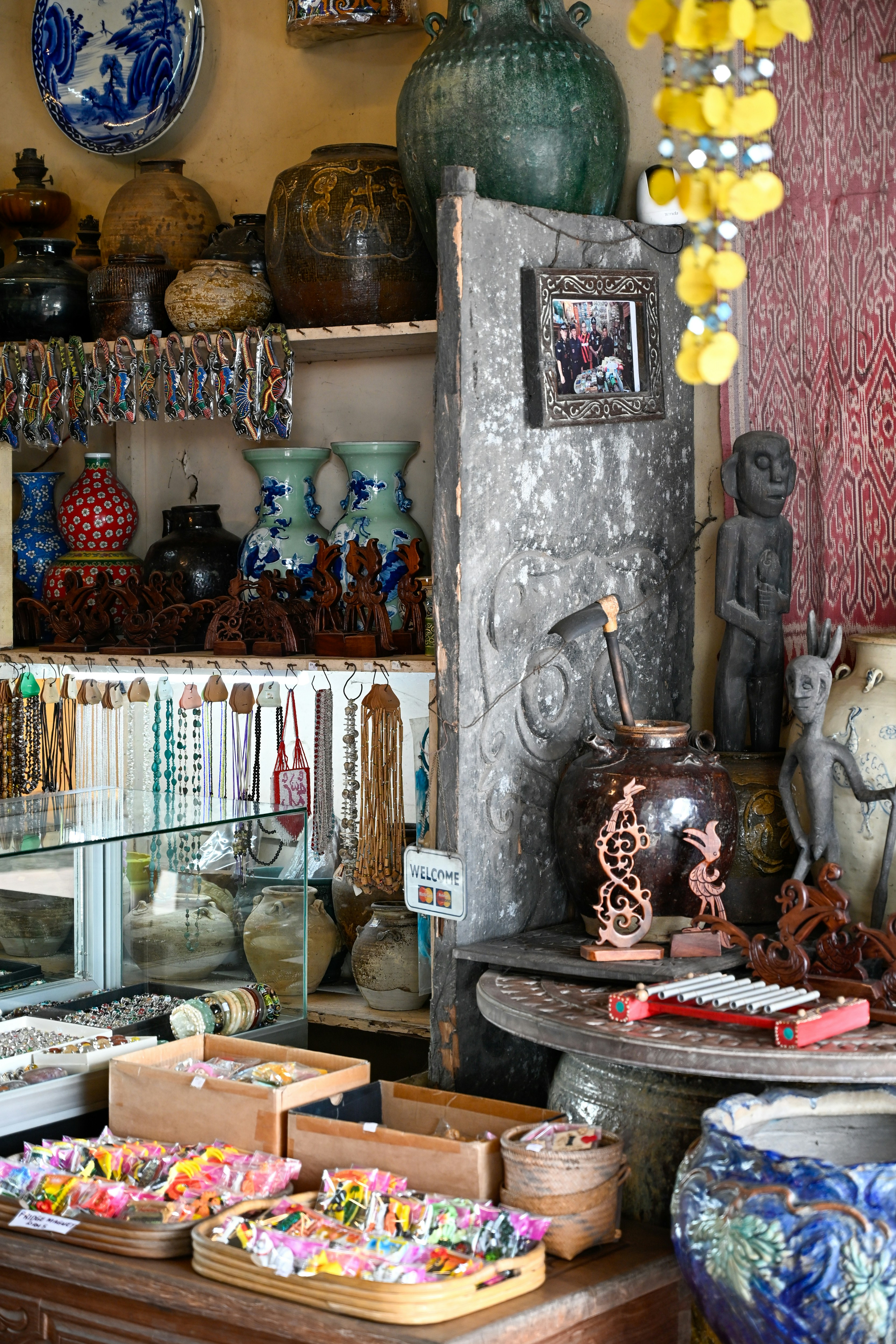 Eclectic Treasure Shelf: A Curated Jumble of Ceramics, Jewelry, and Figurines