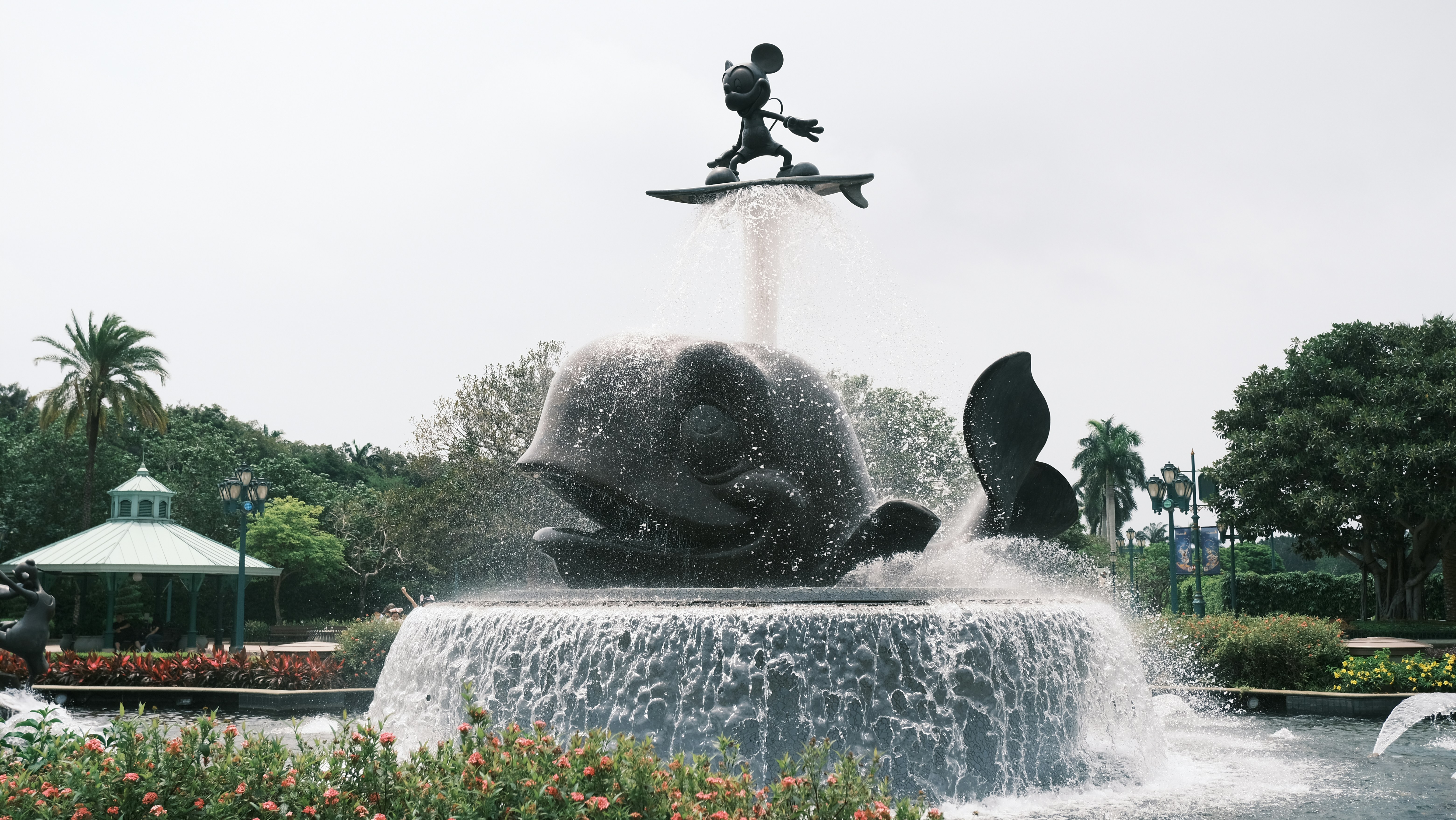 Surfing Statue over Cascading Fountain: a playful landmark