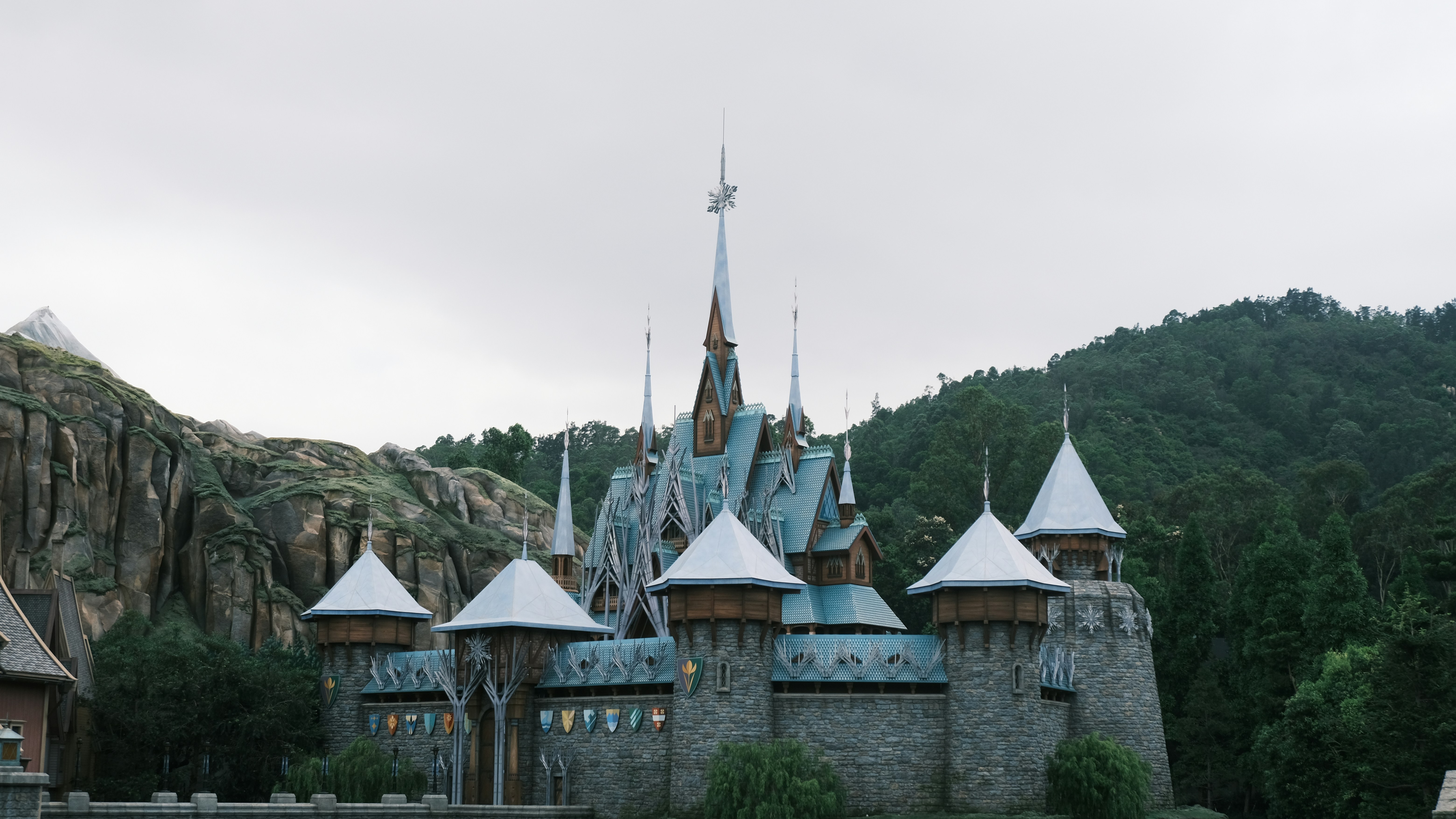 A majestic castle nestled among forested mountains