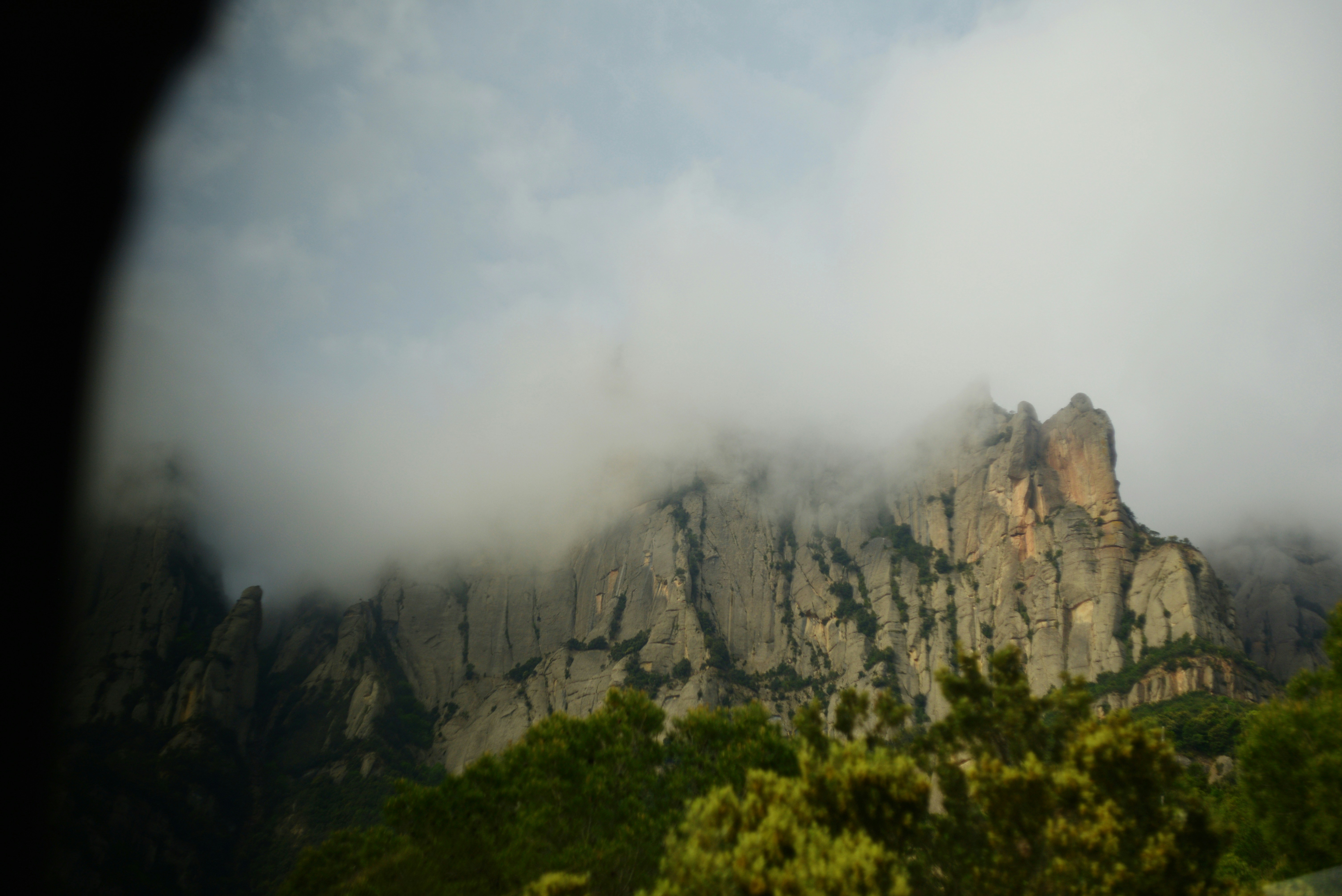 Storm-quiet Peaks Behind a Car Window