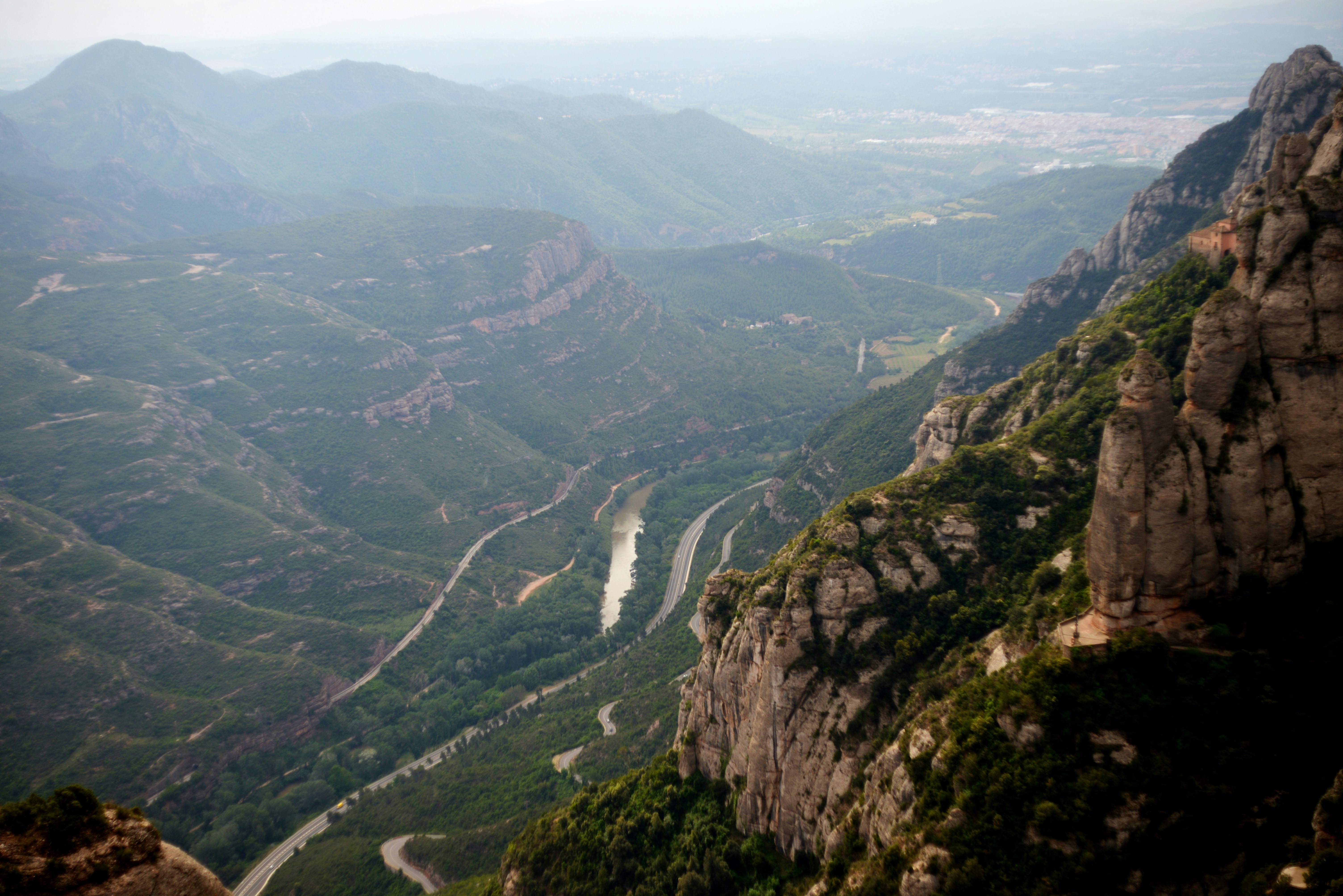 Terraced canyon overlook: winding river carved through rugged escarpments