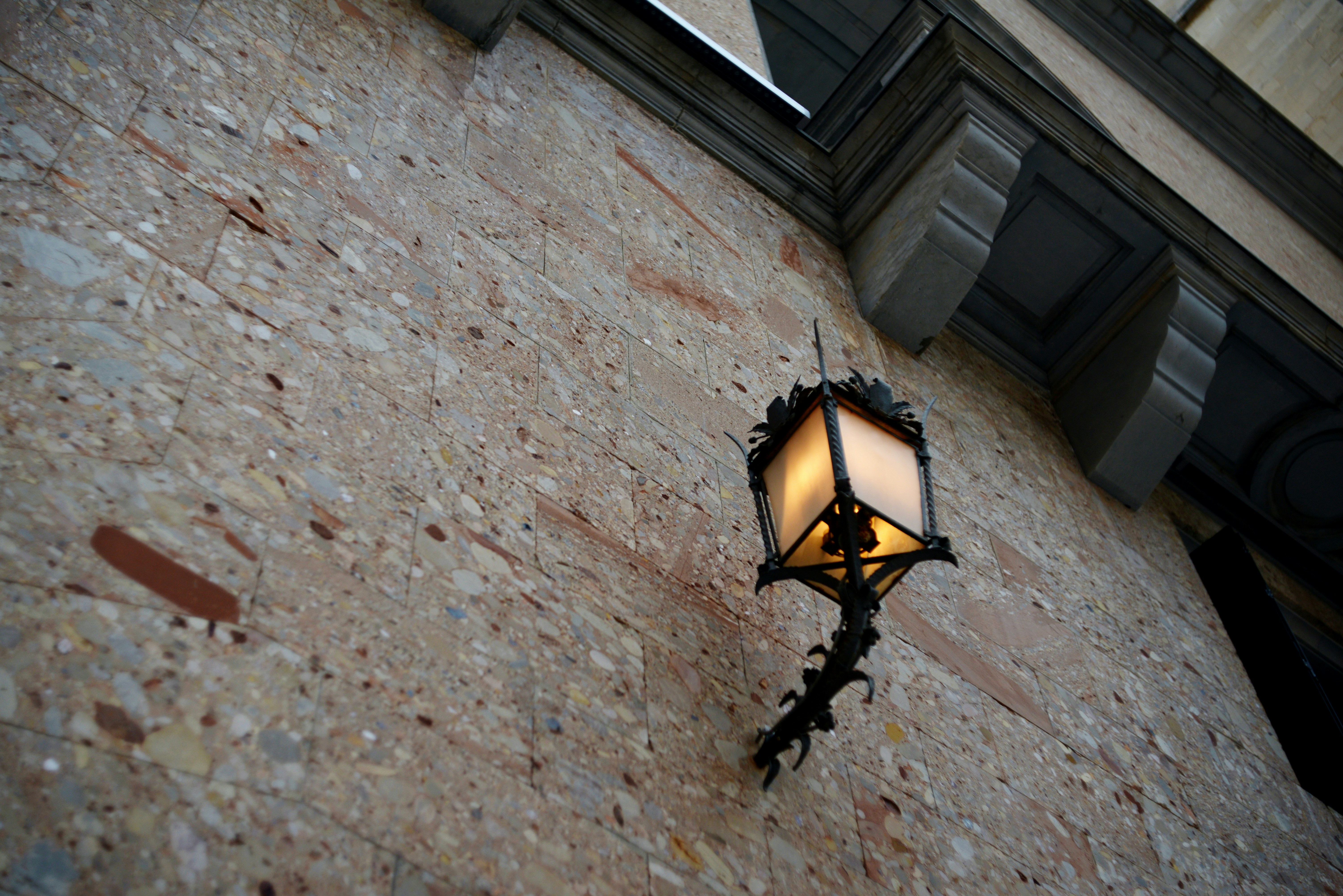 A Lantern Dangled on a Vintage Facade