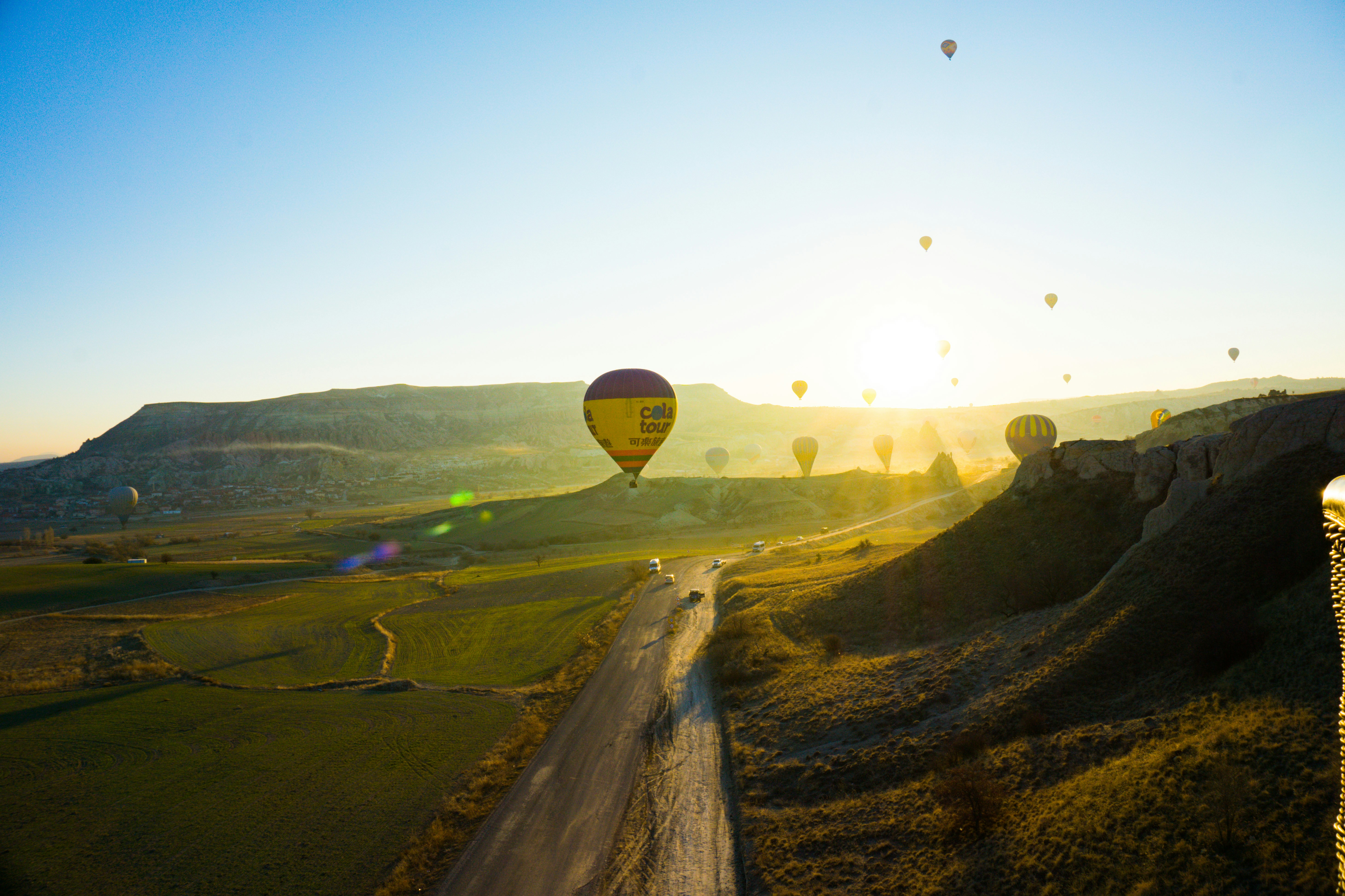 Sunrise over a Field of Soaring Balloons
