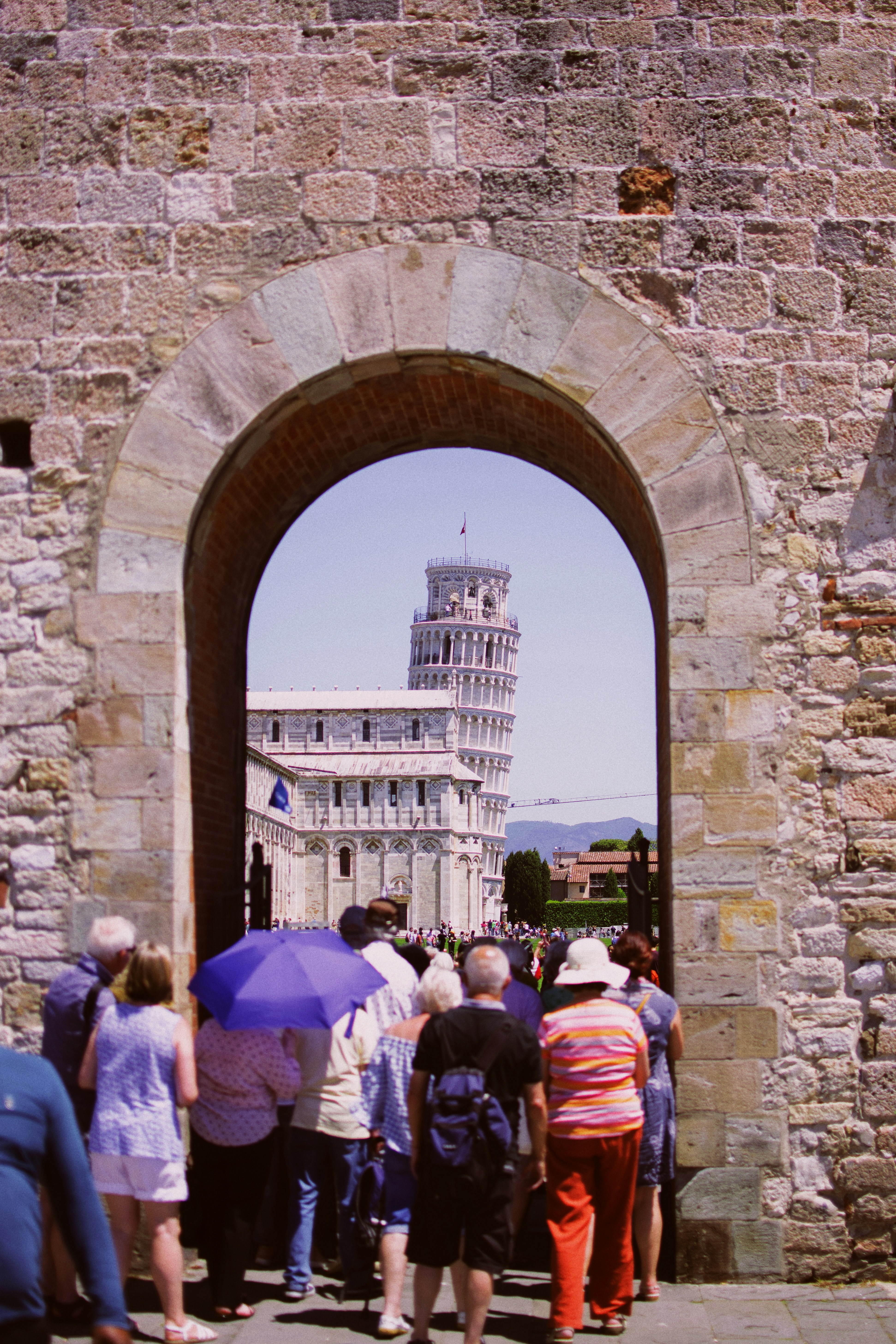 Through the Arch to the Leaning Tower: Crowd Framed View near Pisa