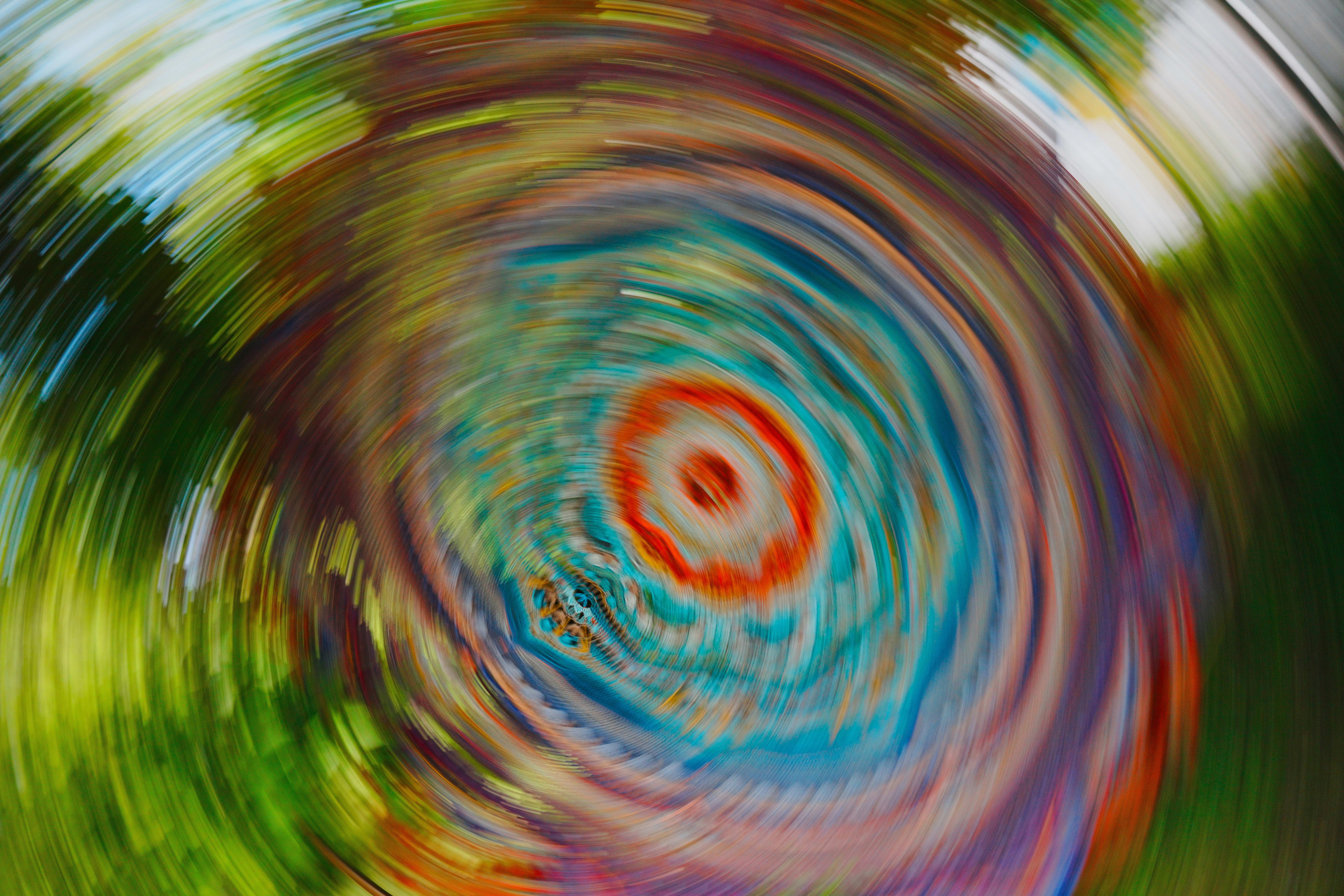Spiral Playground: A Colorful Blur Centered on the Carousel Core
