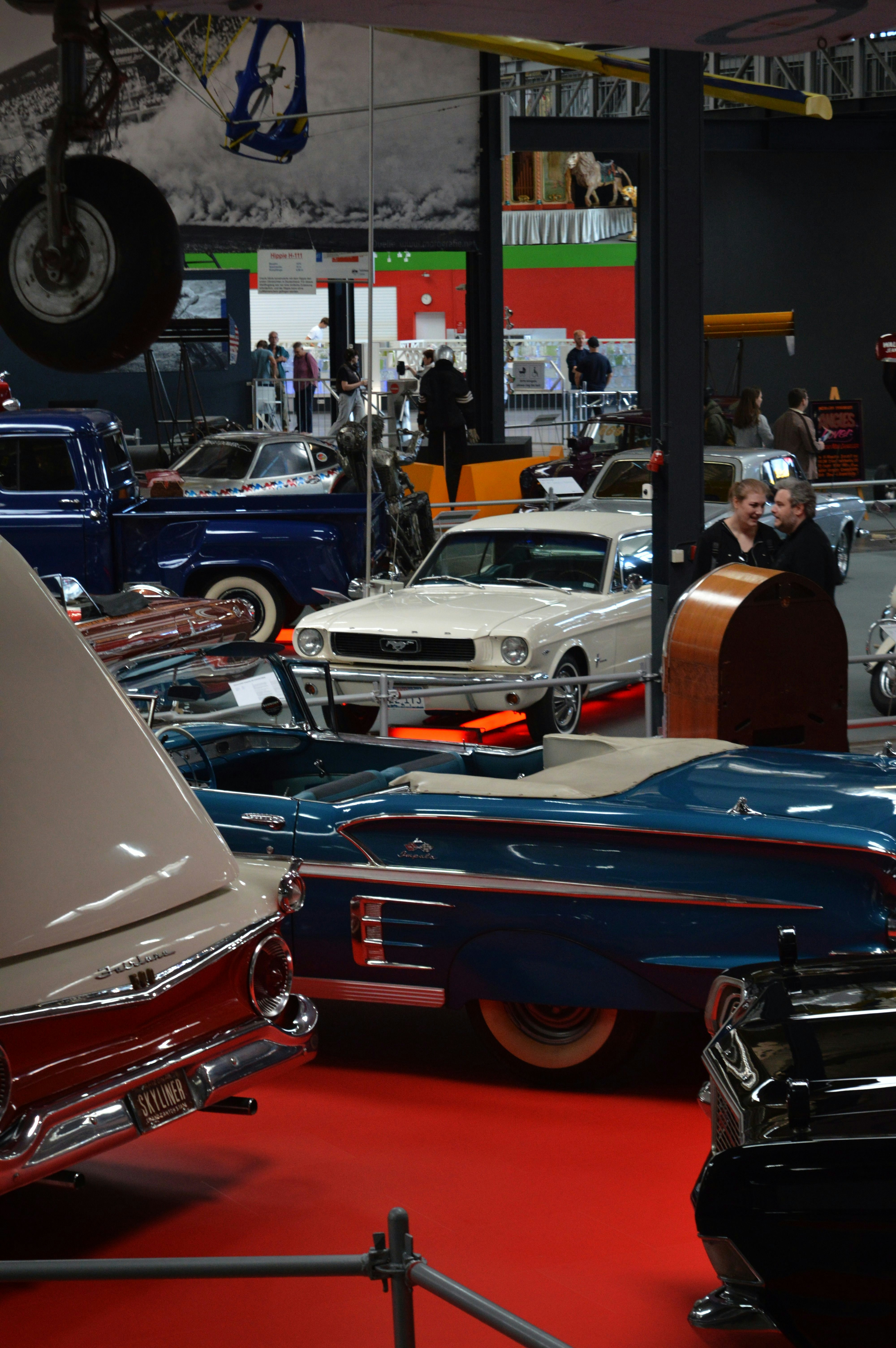 Midnight Showroom: Classic Cars Under Exhibition Lights