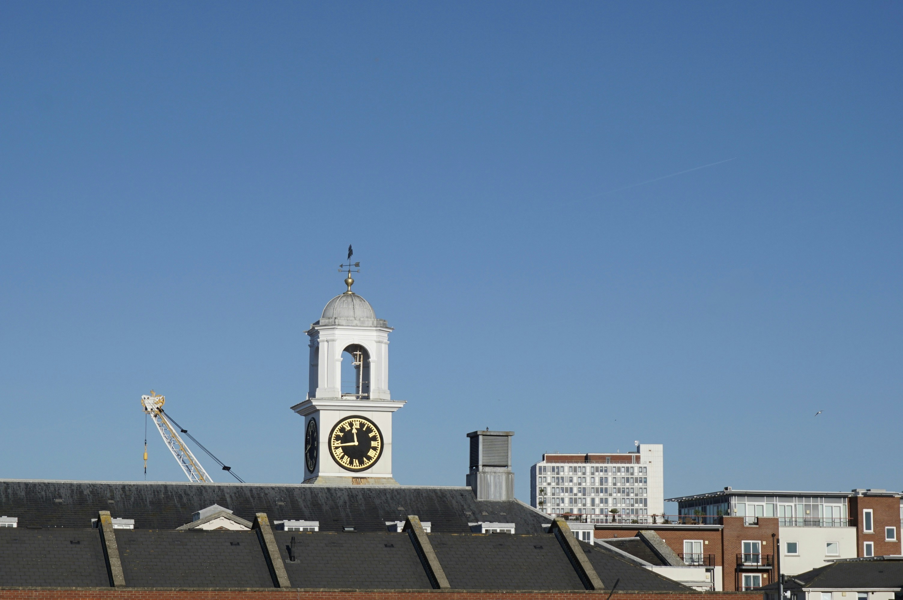 Clocktower on a Calm Rooftop