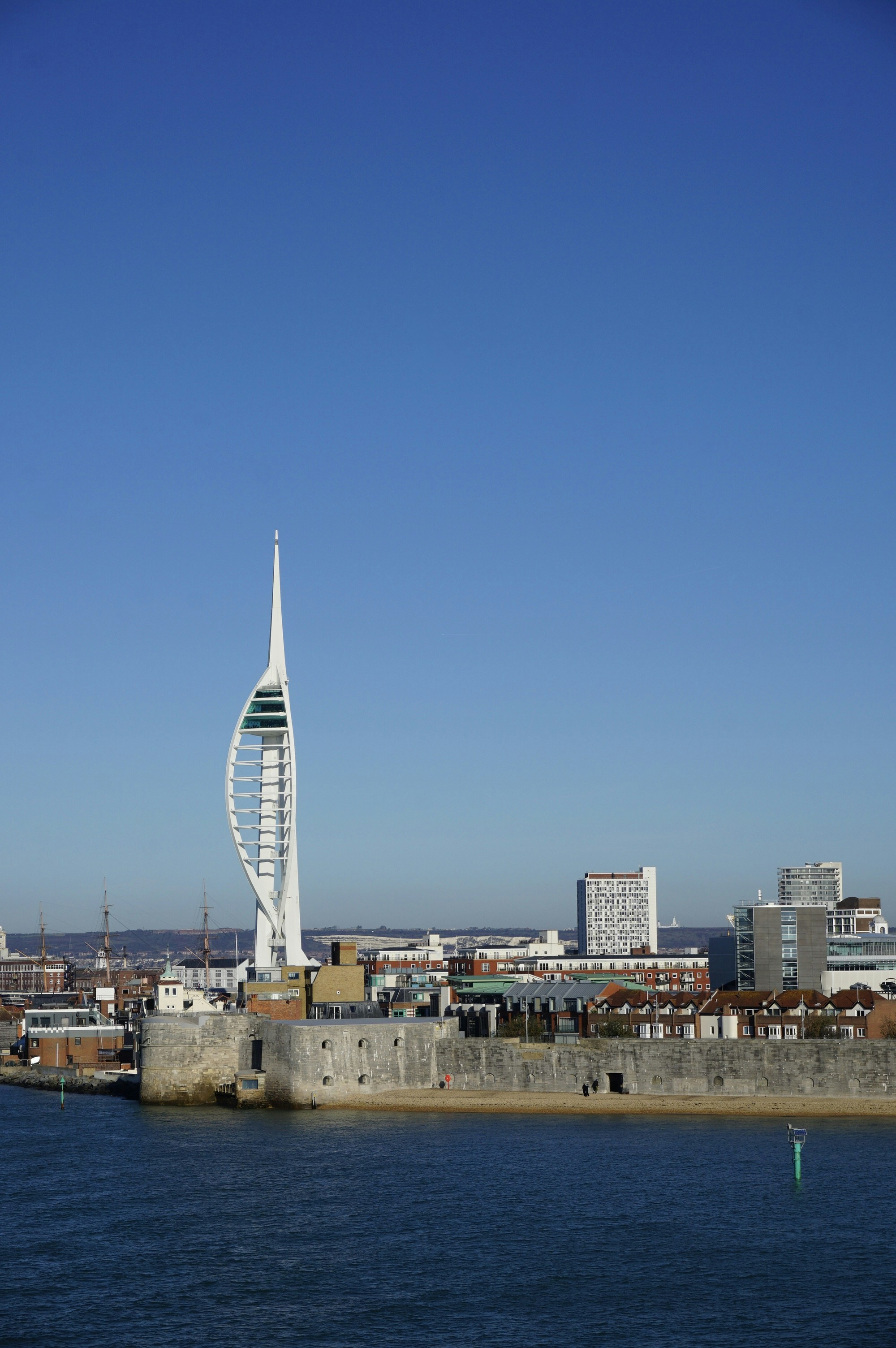 Sail of the City: a modern tower rising over a harbor