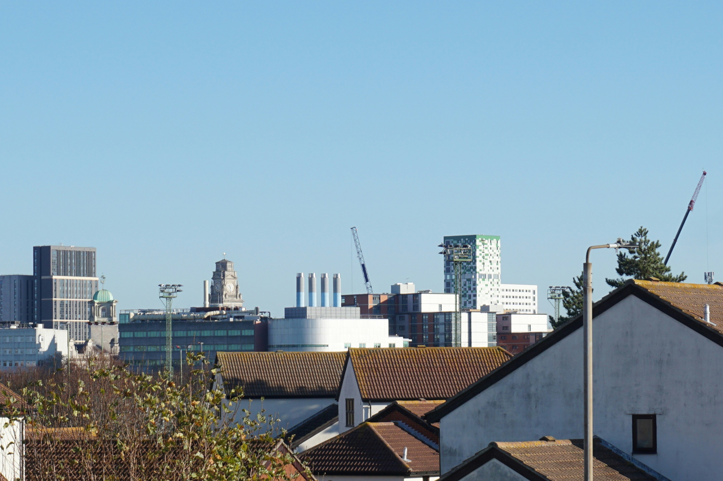 Urban skyline awakens over terracotta rooftops