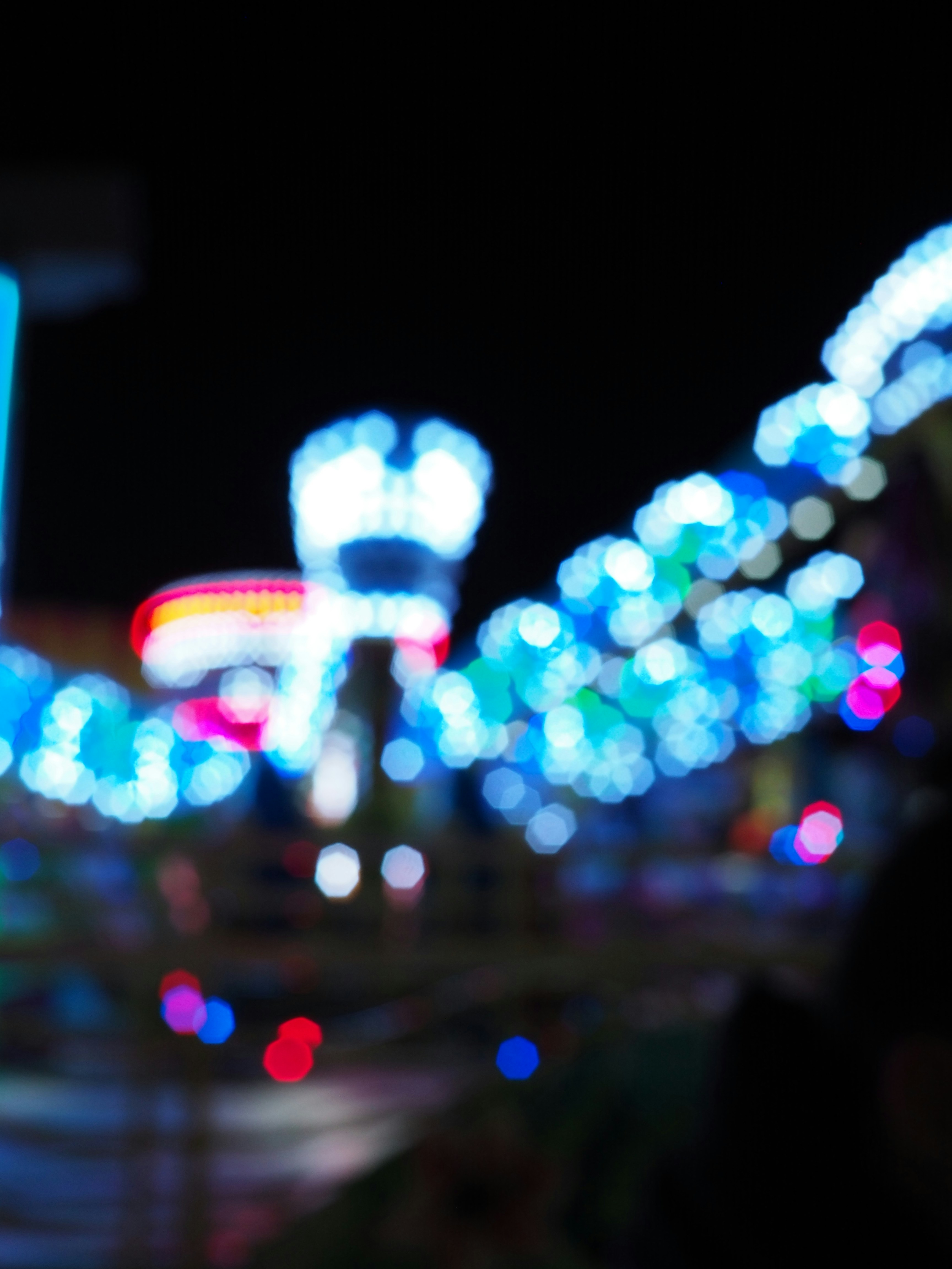 Night Carousel Glow: Bokeh Lights in Motion