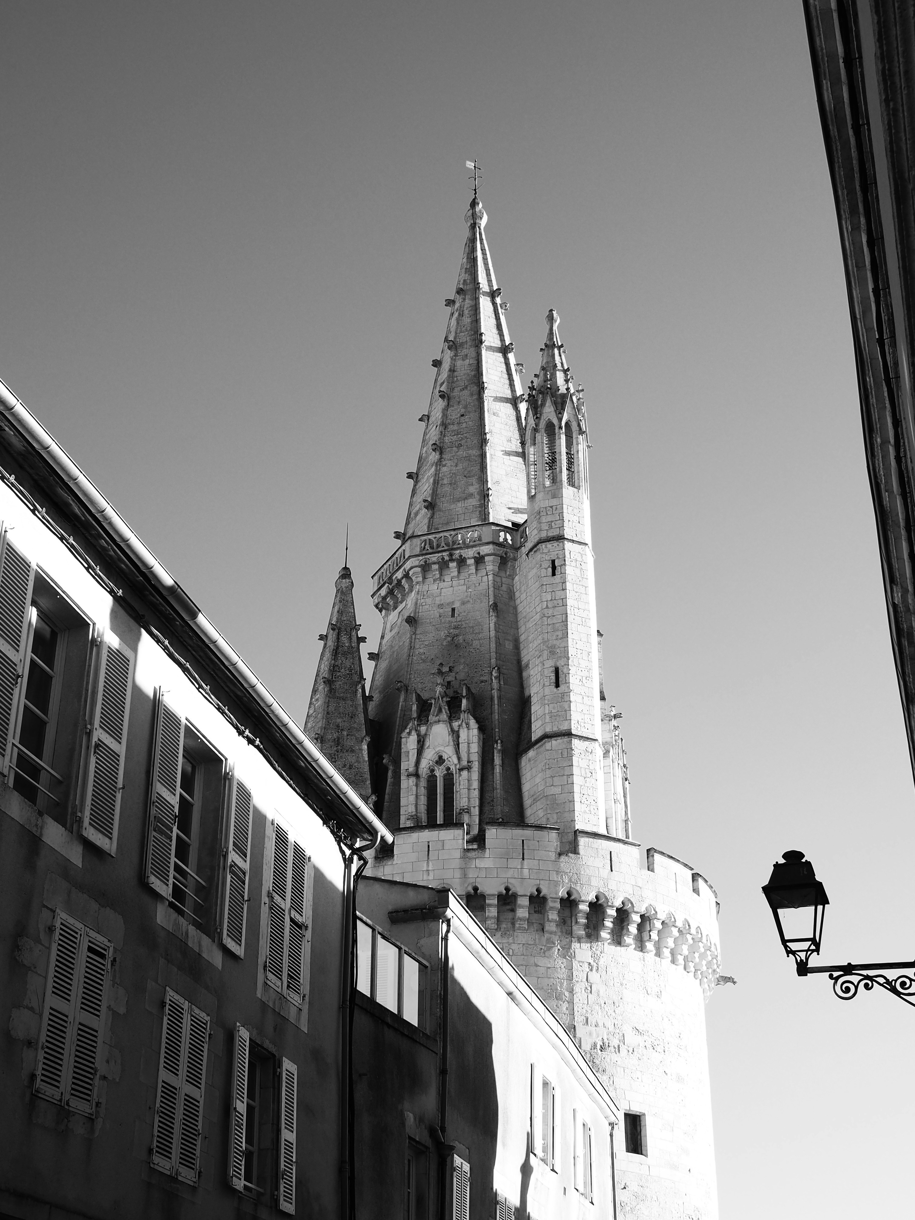 Towering Spires Against a Narrow City Corridor