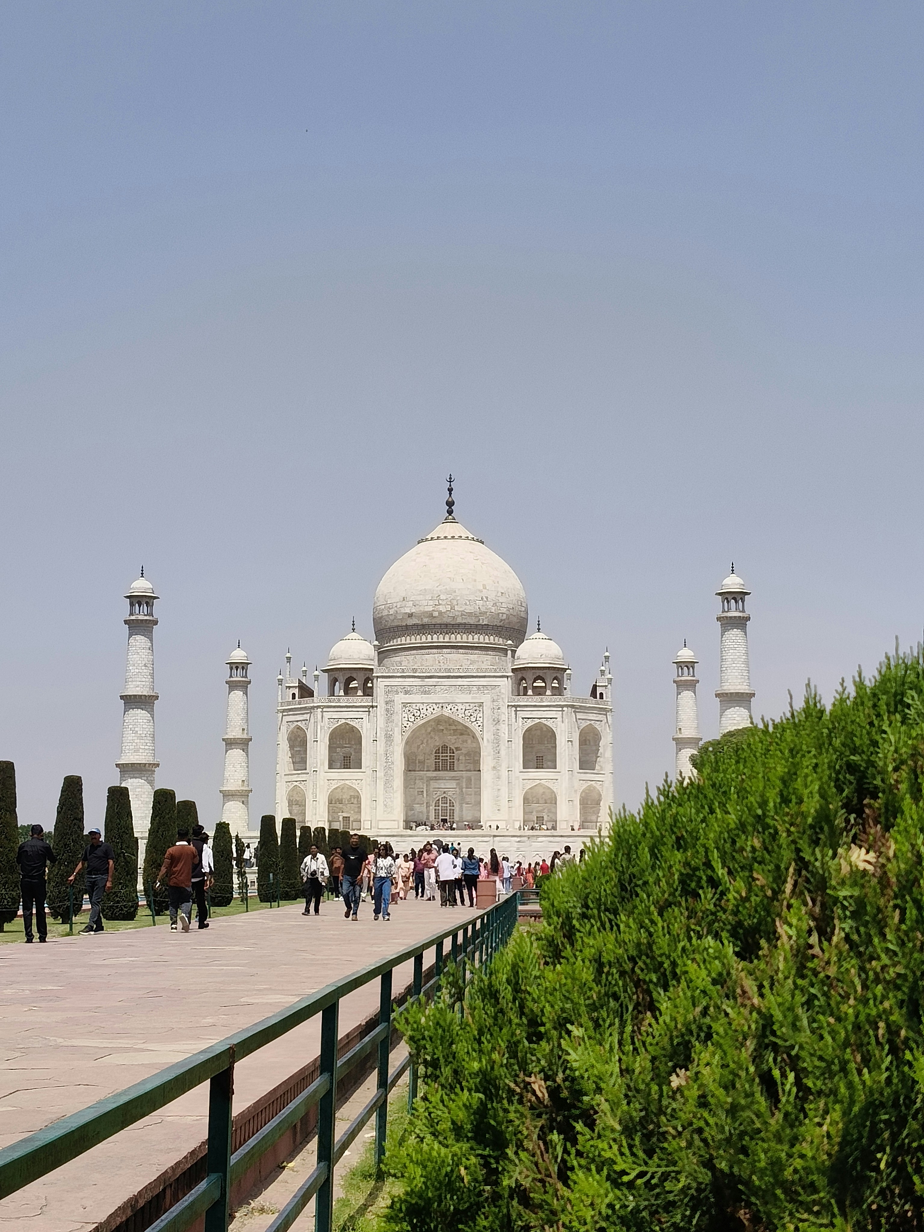 The taj mahal mausoleum with visitors walking nearby photo – Free ...