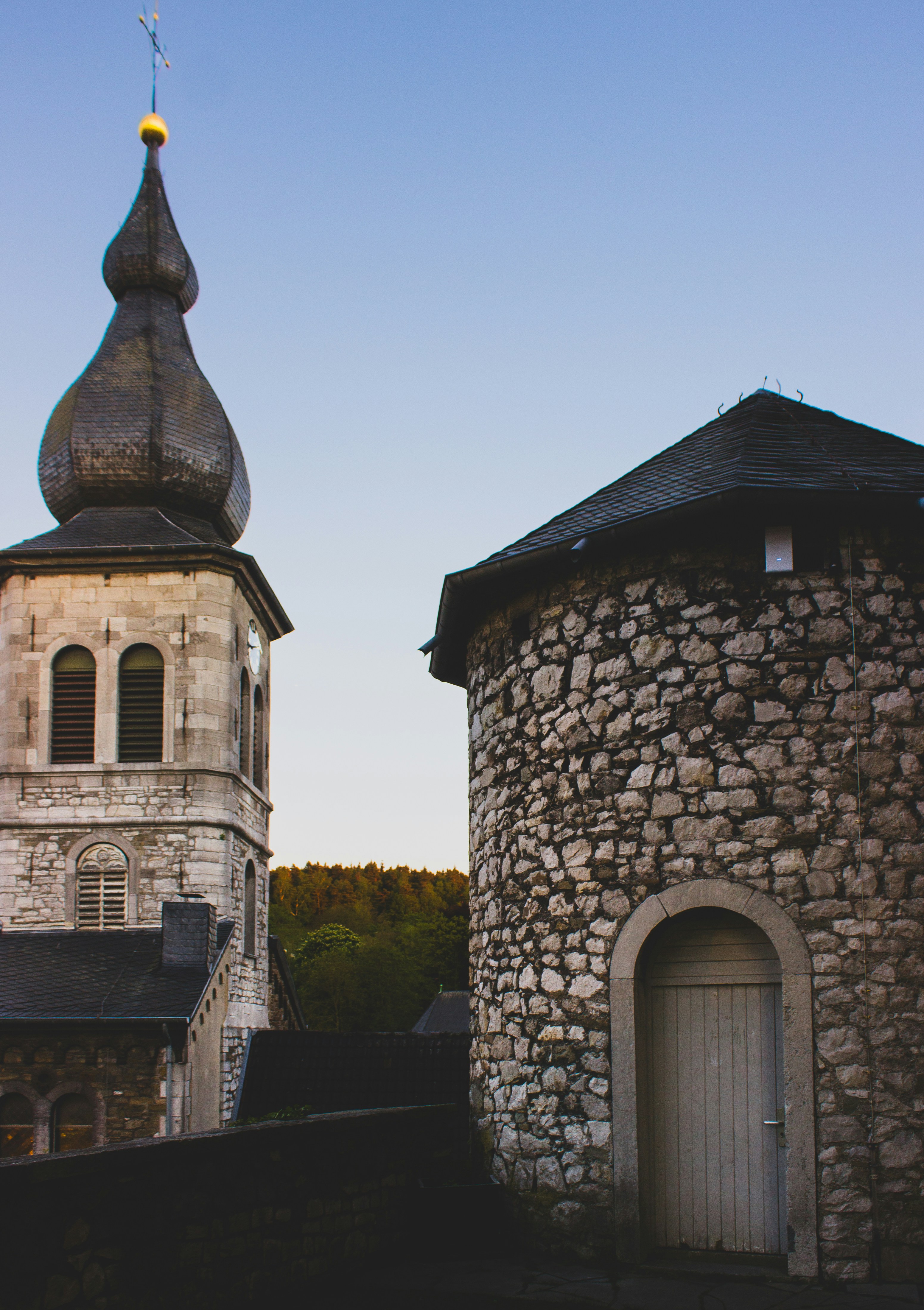 Stone Towers at Dusk: A Quiet Alpine Courtyard