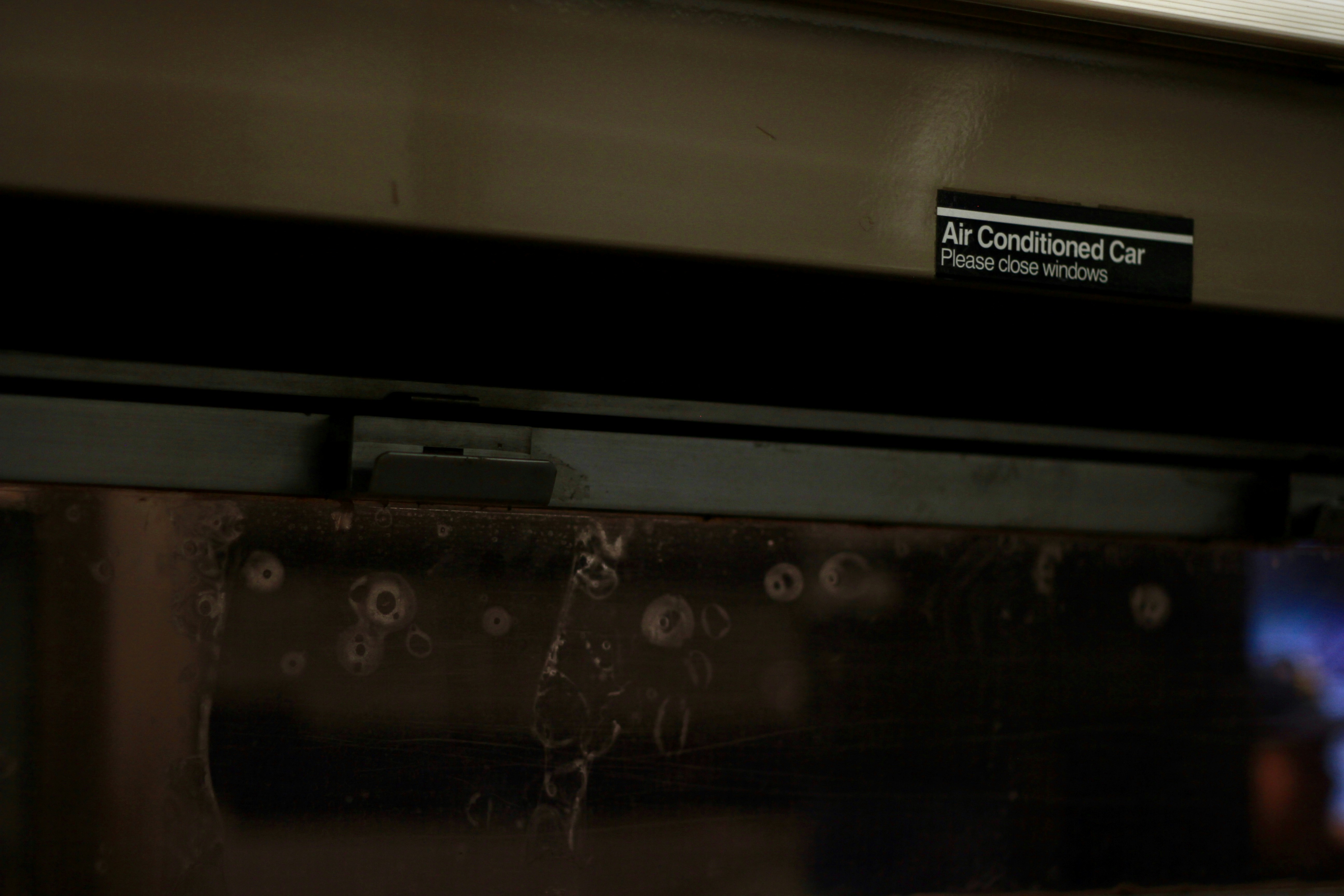 The Quiet Sign: Close-Up of a Car Window Sticker in Low Light
