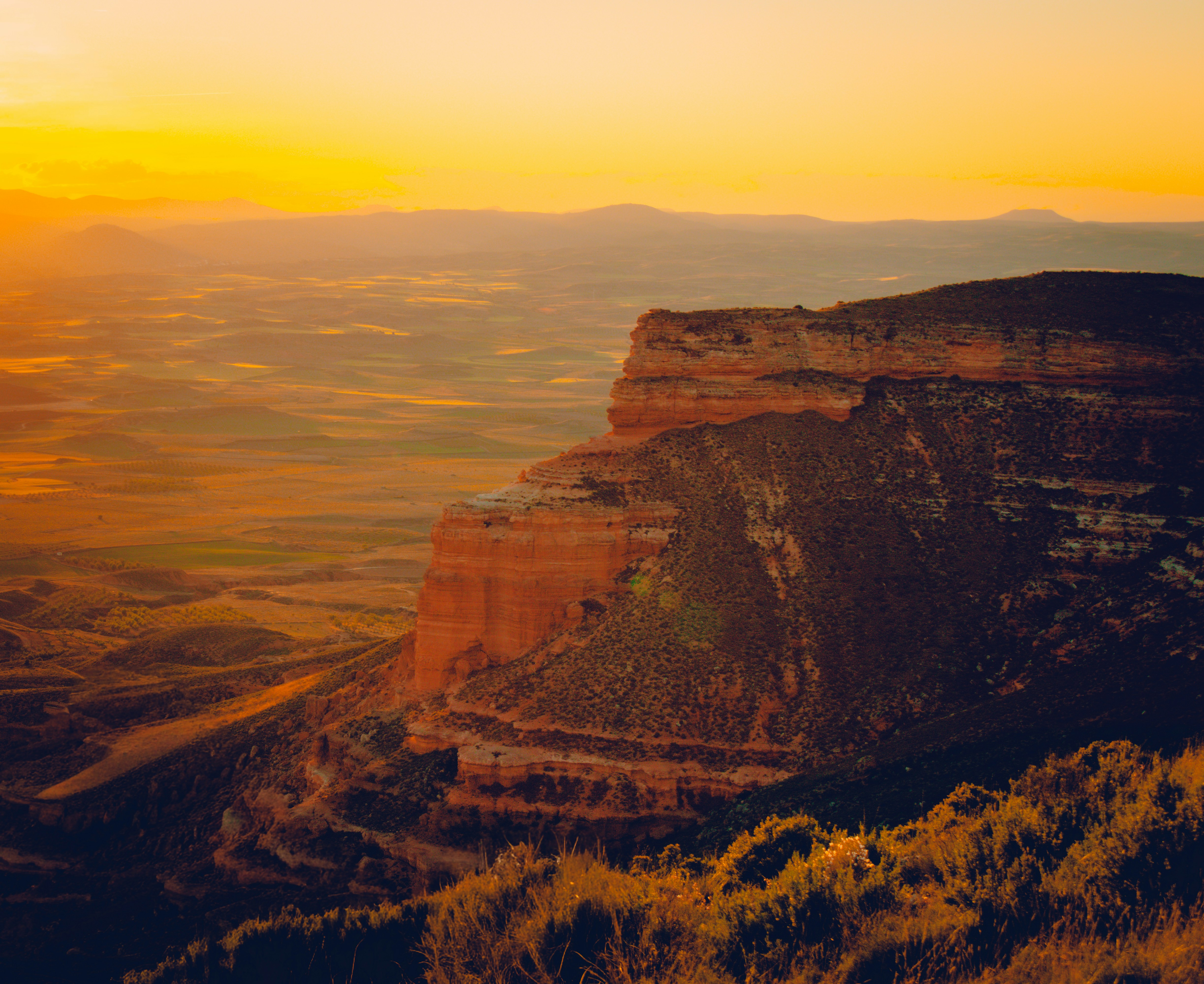 Golden Edge: Sunset Over Bluffs