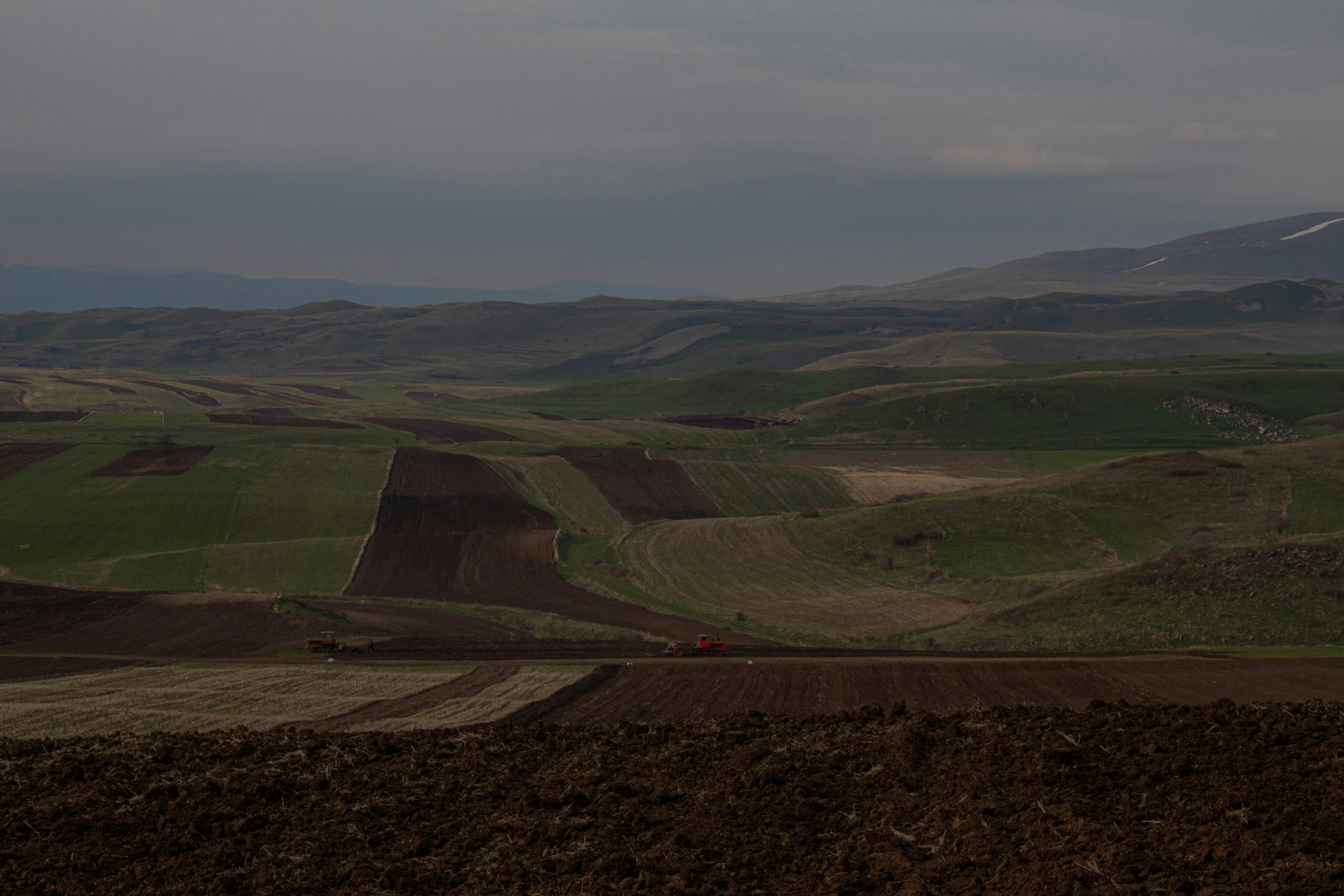 Terraced Horizons: A Quiet Seascape of Farmland and Rolling Hills