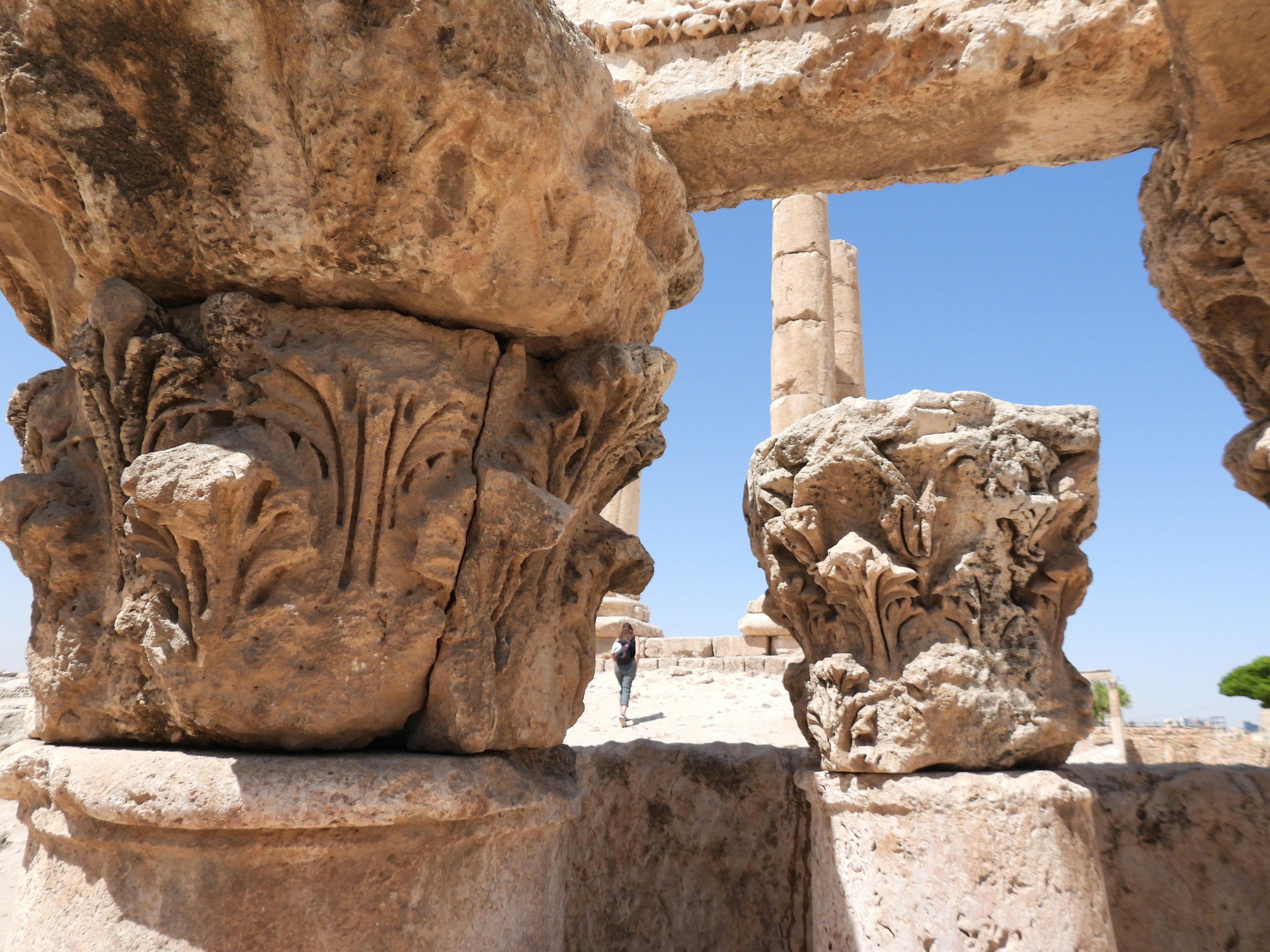 Stone Carved Gateway Beneath a Sky-Blue Arch