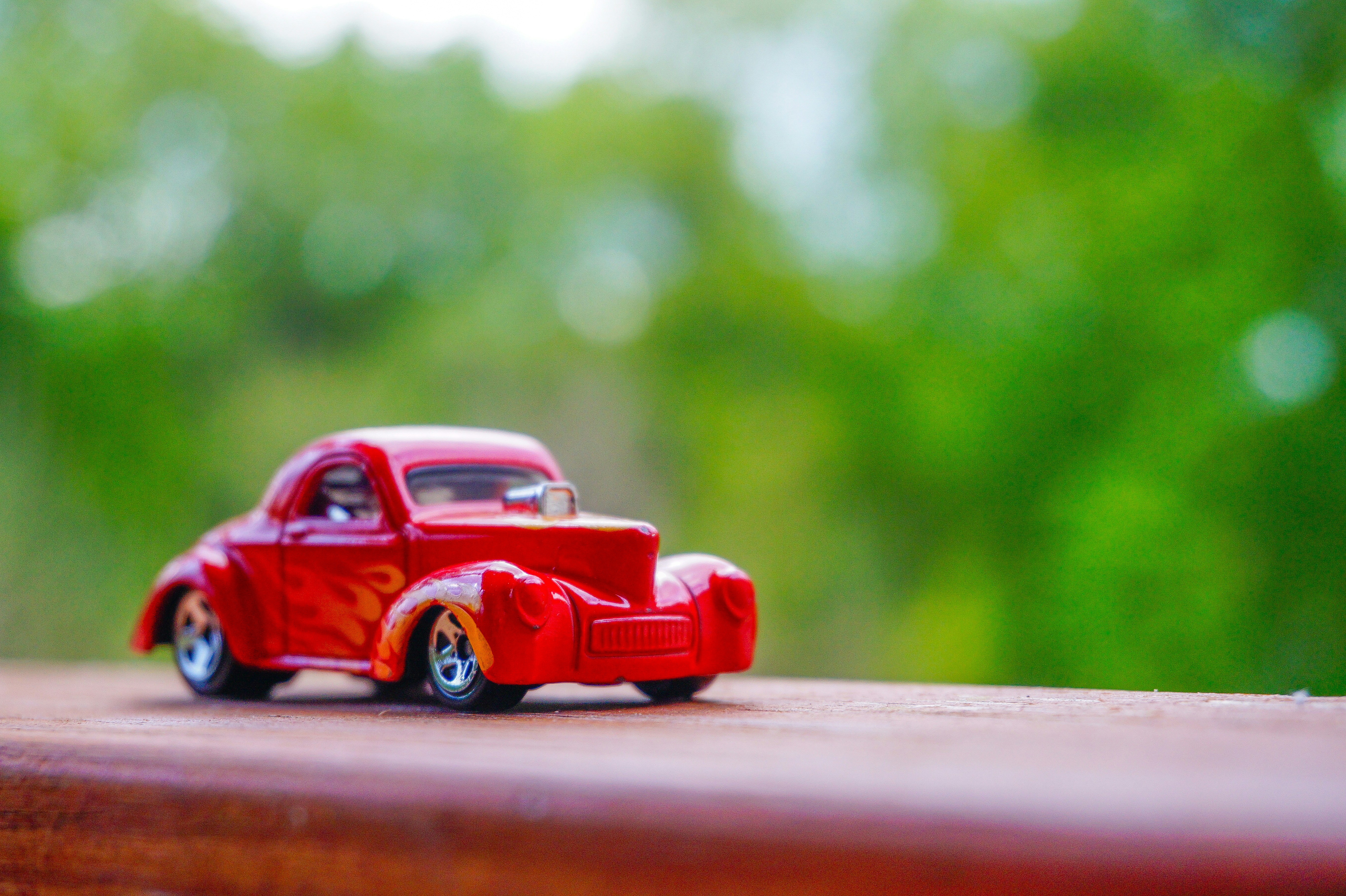 Tiny Racer on a Wooden Stage