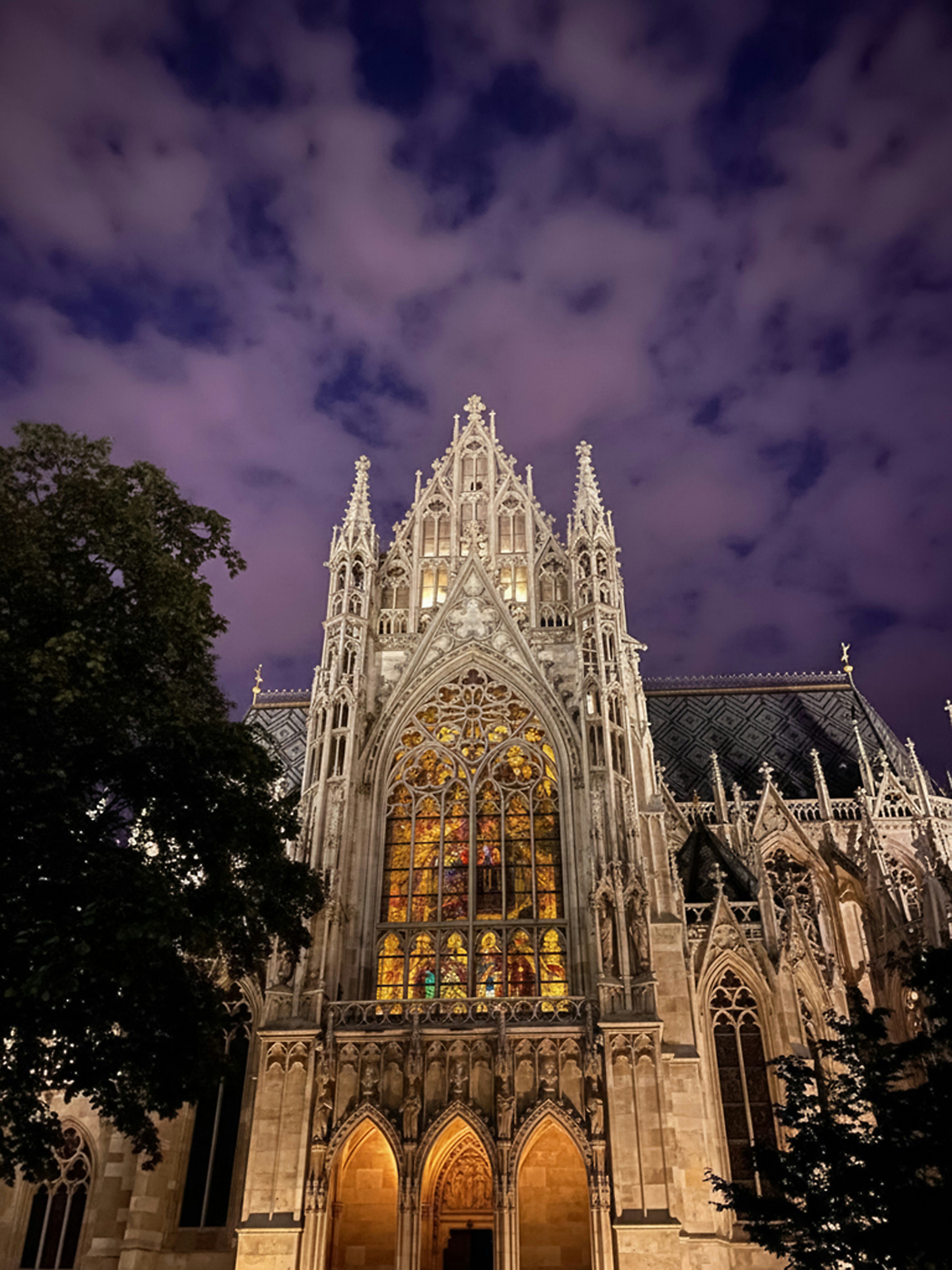Gothic Cathedral at Night: Illuminated Facade Reaching Toward the Sky