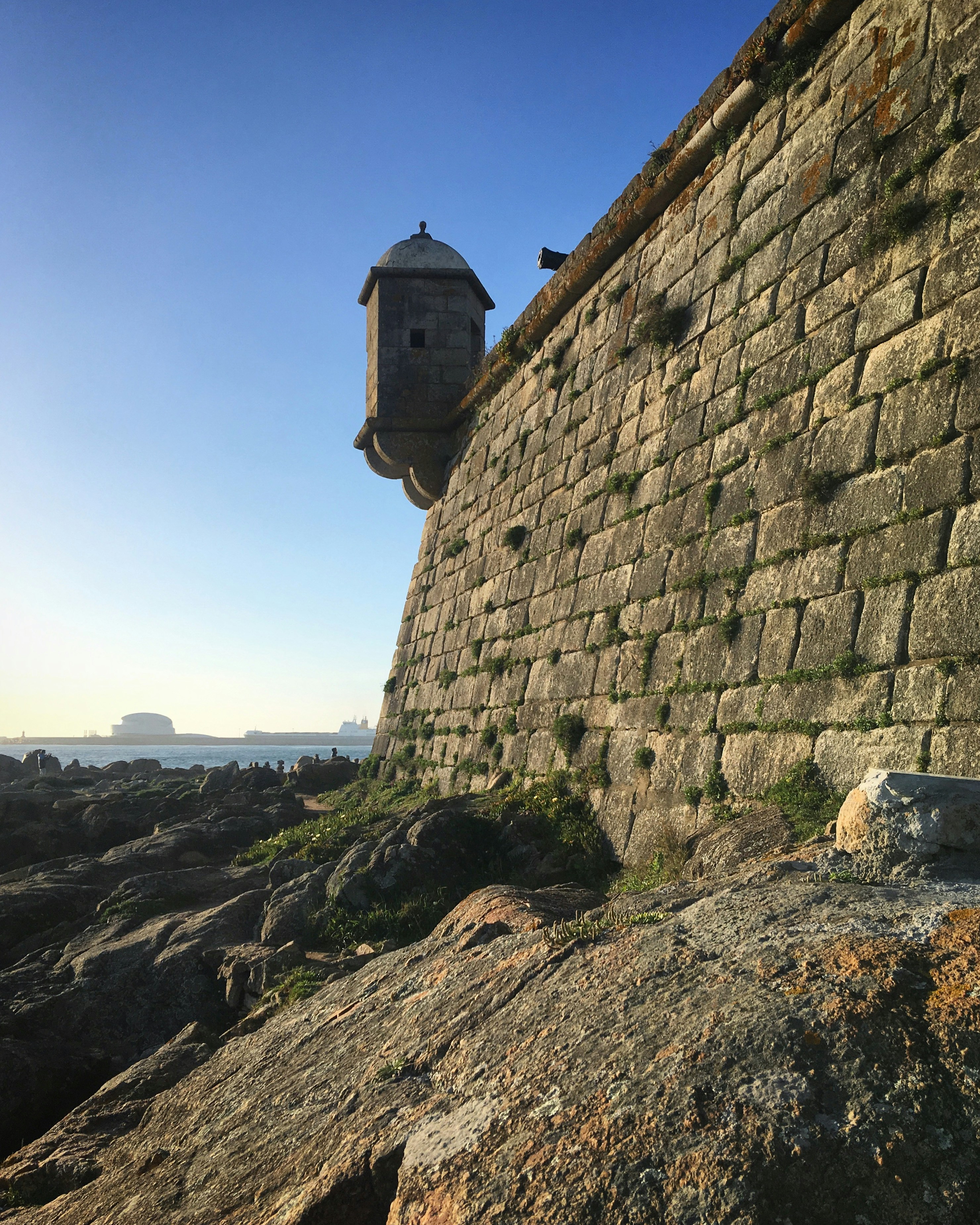 Stone Seawall Watchtower Beside the Tidal Rocks