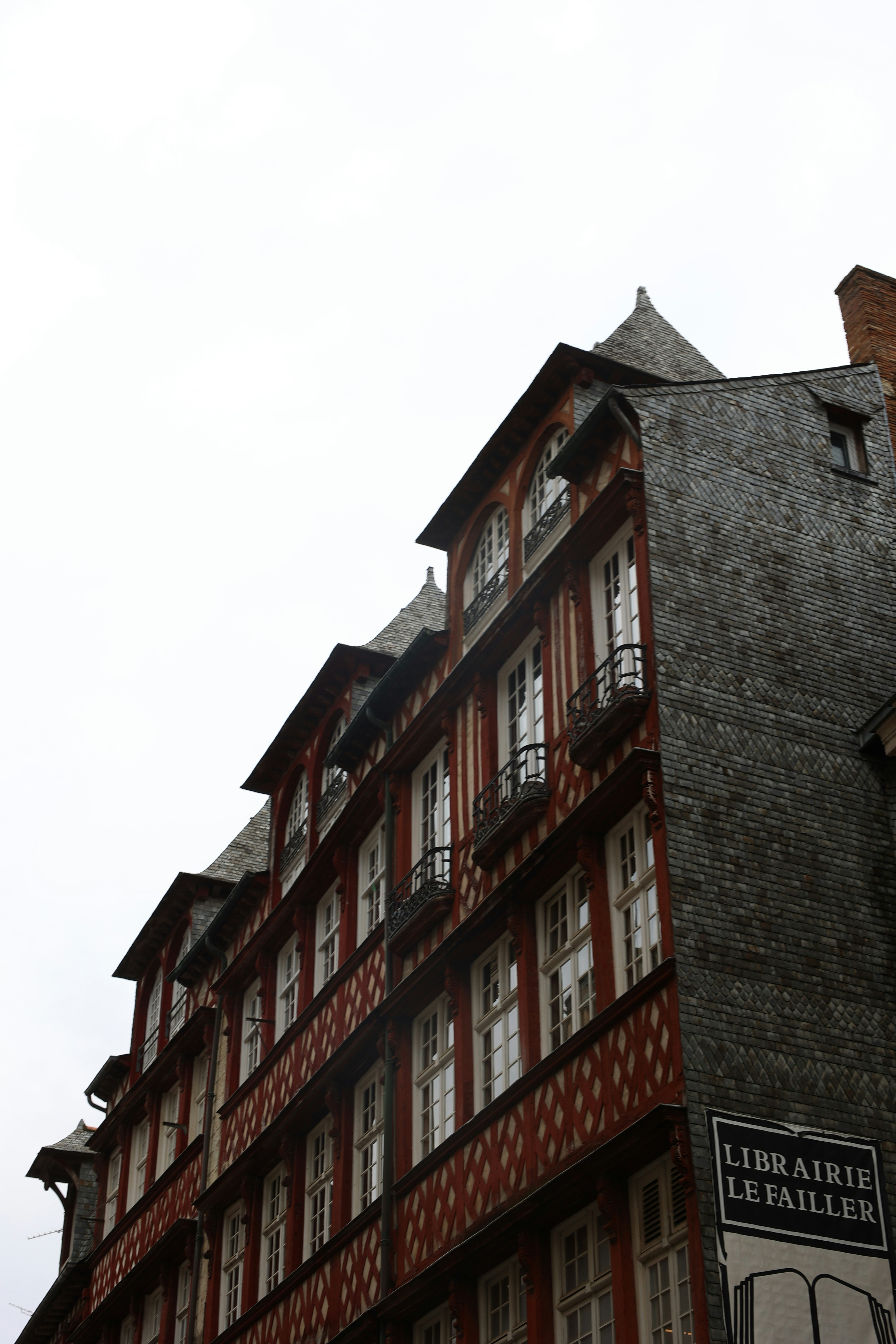 Timbered Facade Rising: A Historic End of Terrace in Red and Stone