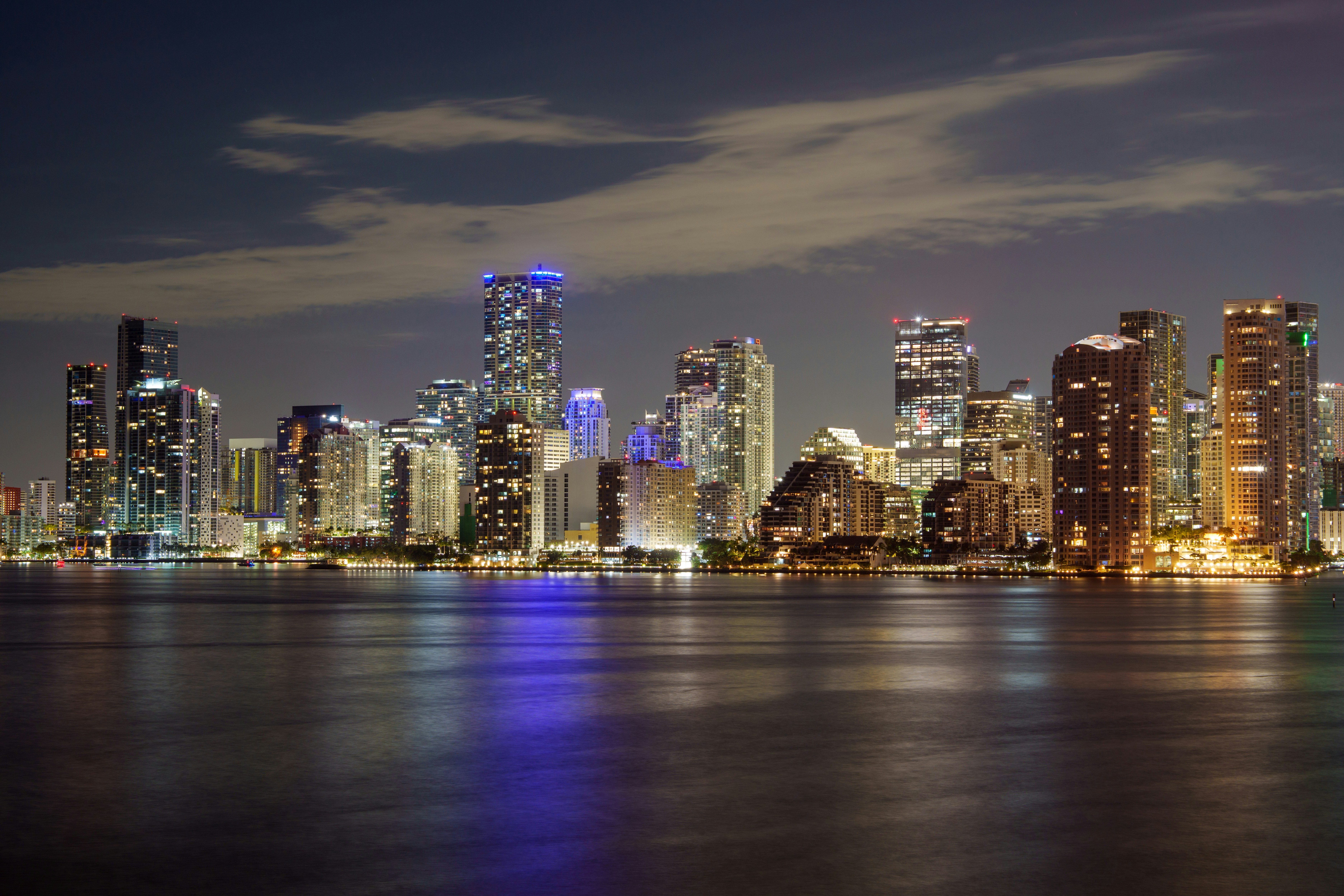 Midnight Harbor: Neon Reflections on a Glassy Cityscape