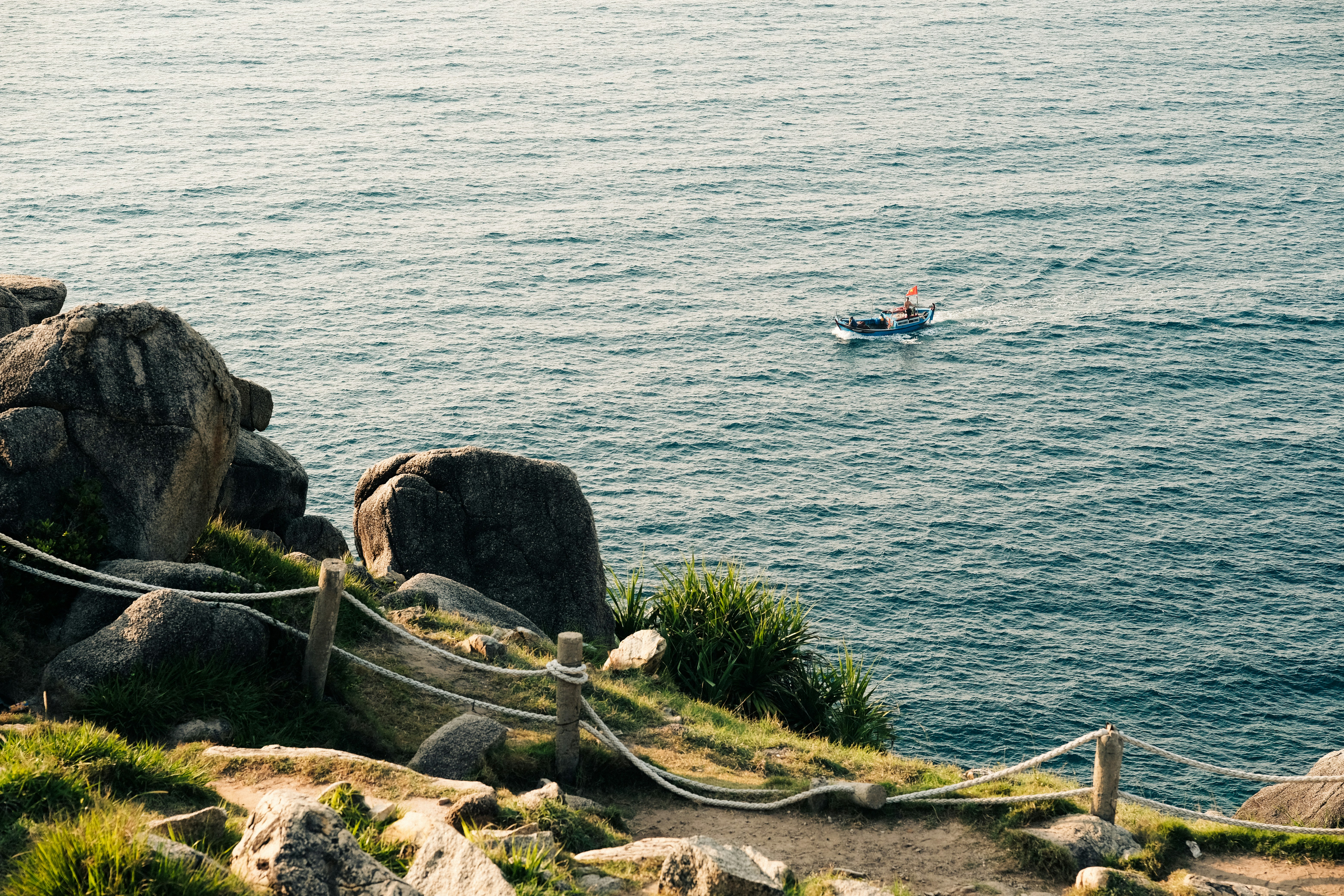 Rugged coastal path Framing a Distant Boat