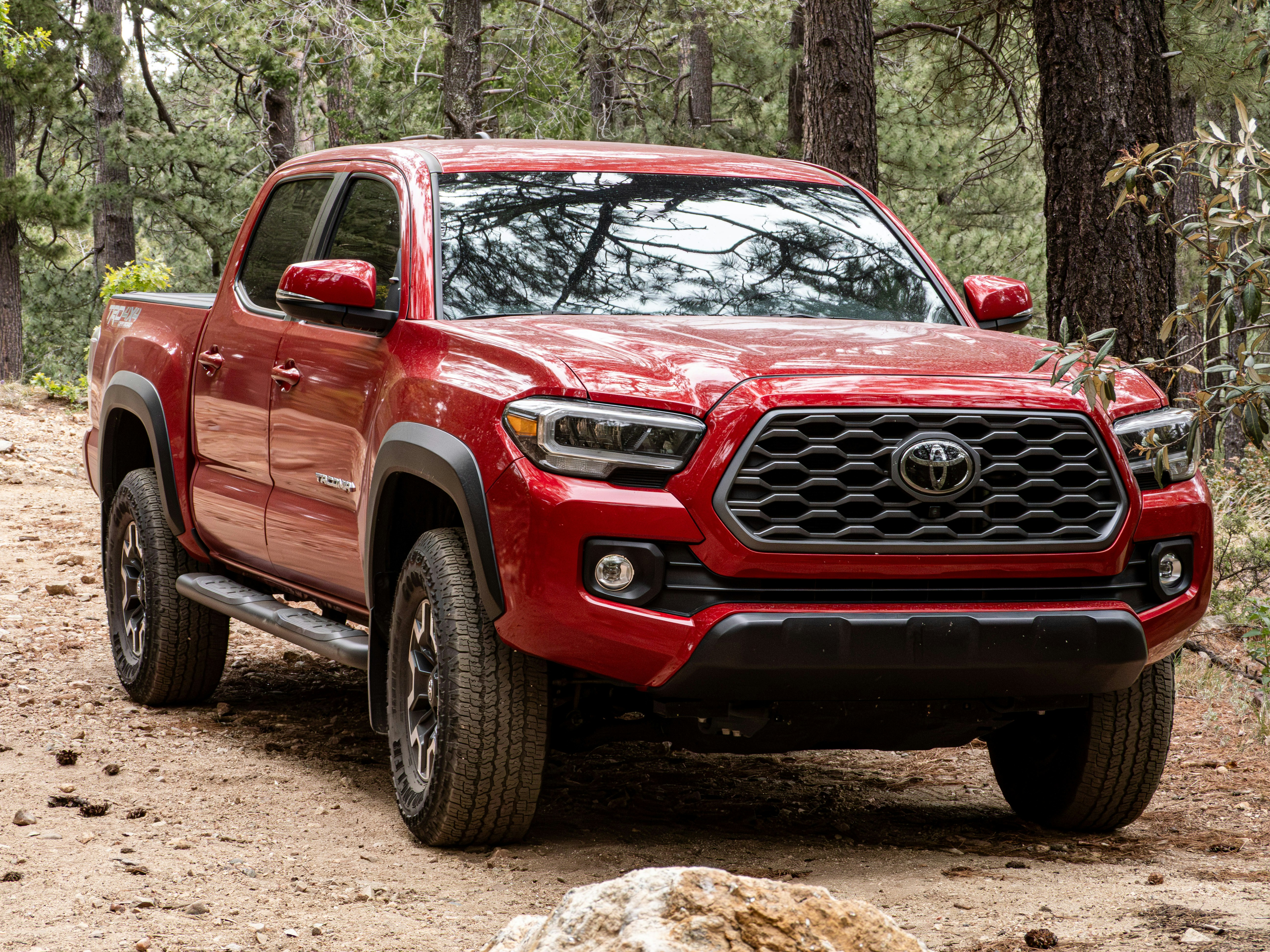 A Toyota Tacoma sitting by trees on the Mt. Lemmon Hiking Trail