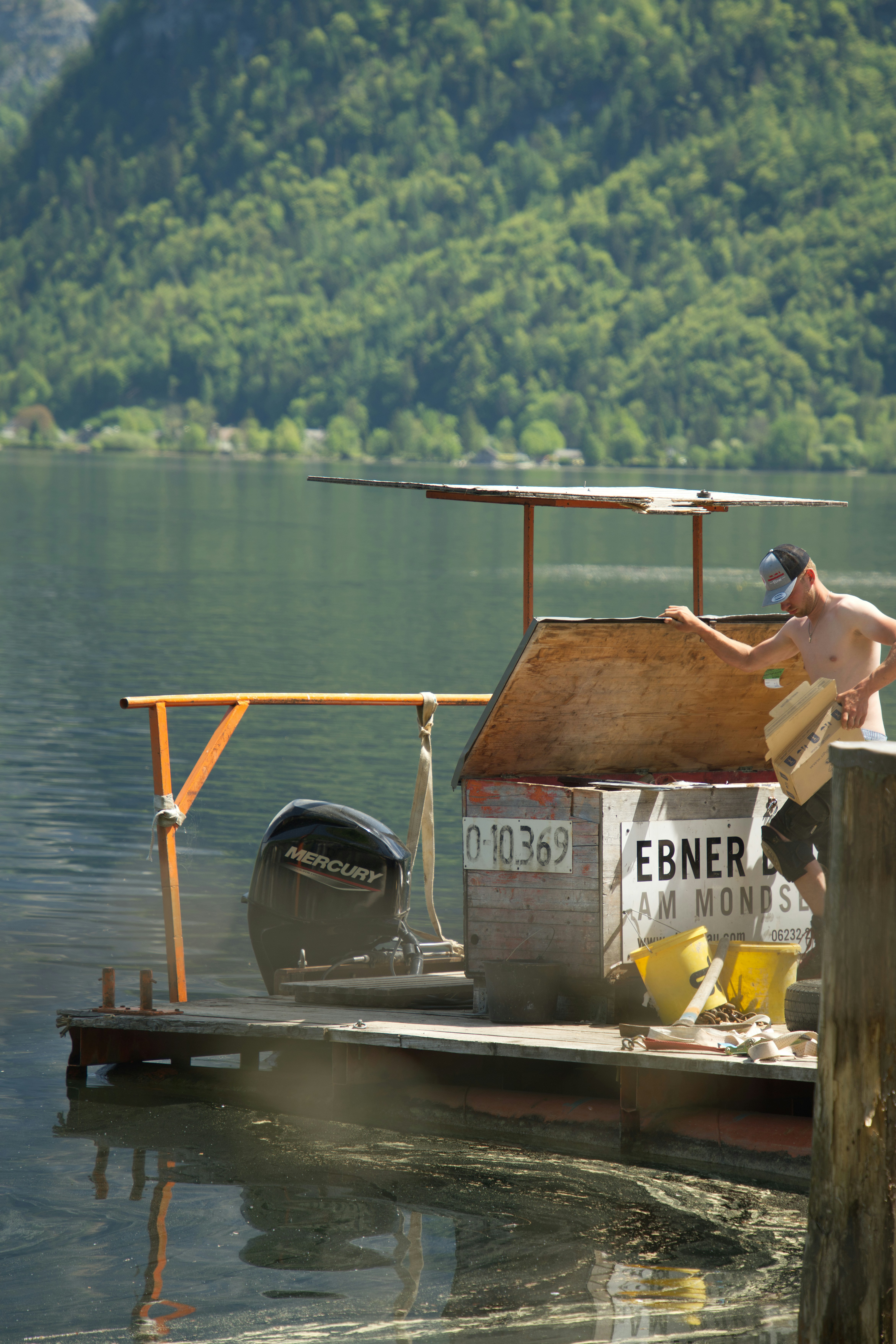 Shoreline Workshop: A Lone Worker at the Floating Dock