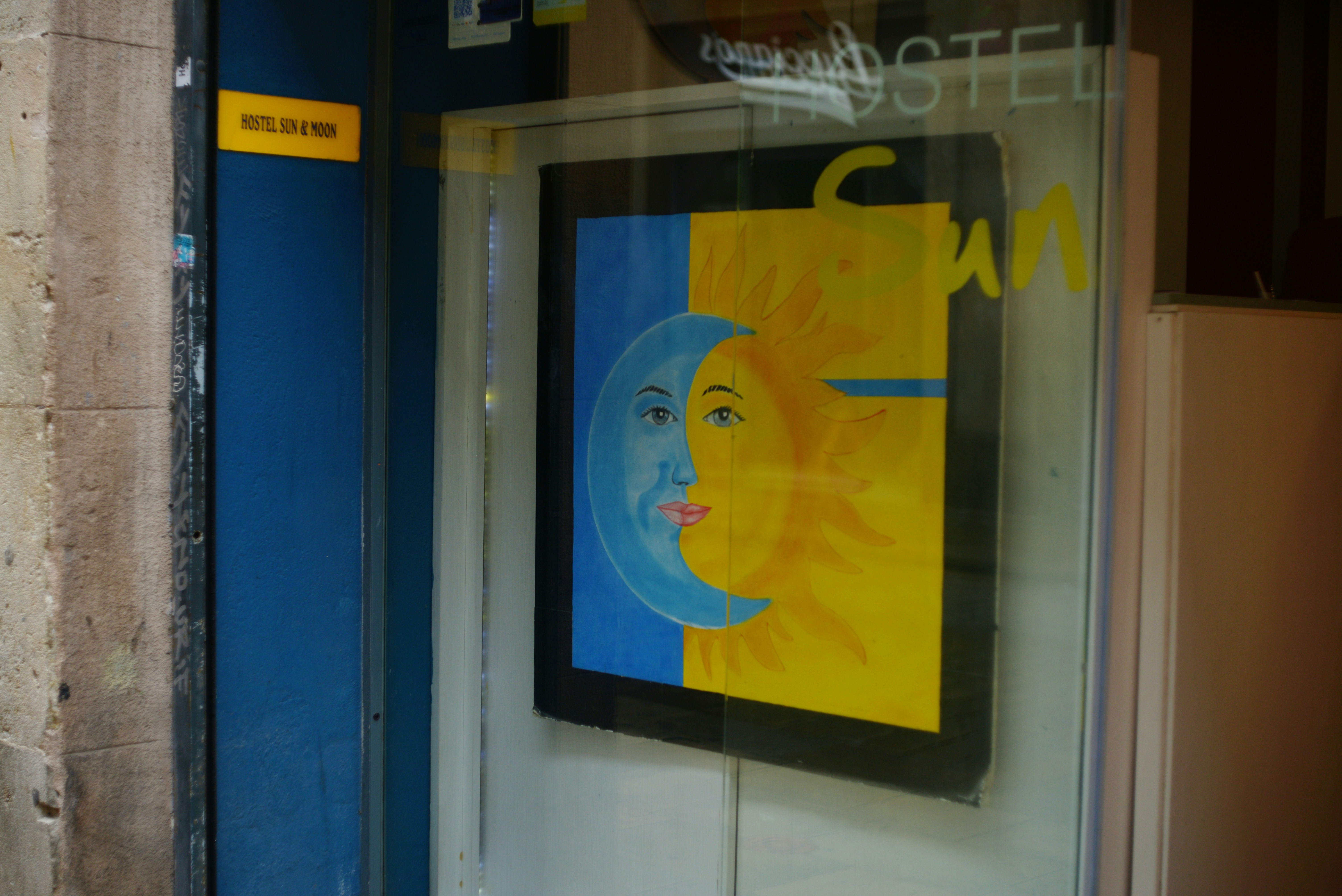 Sun and Moon Portrait in a Glass Window