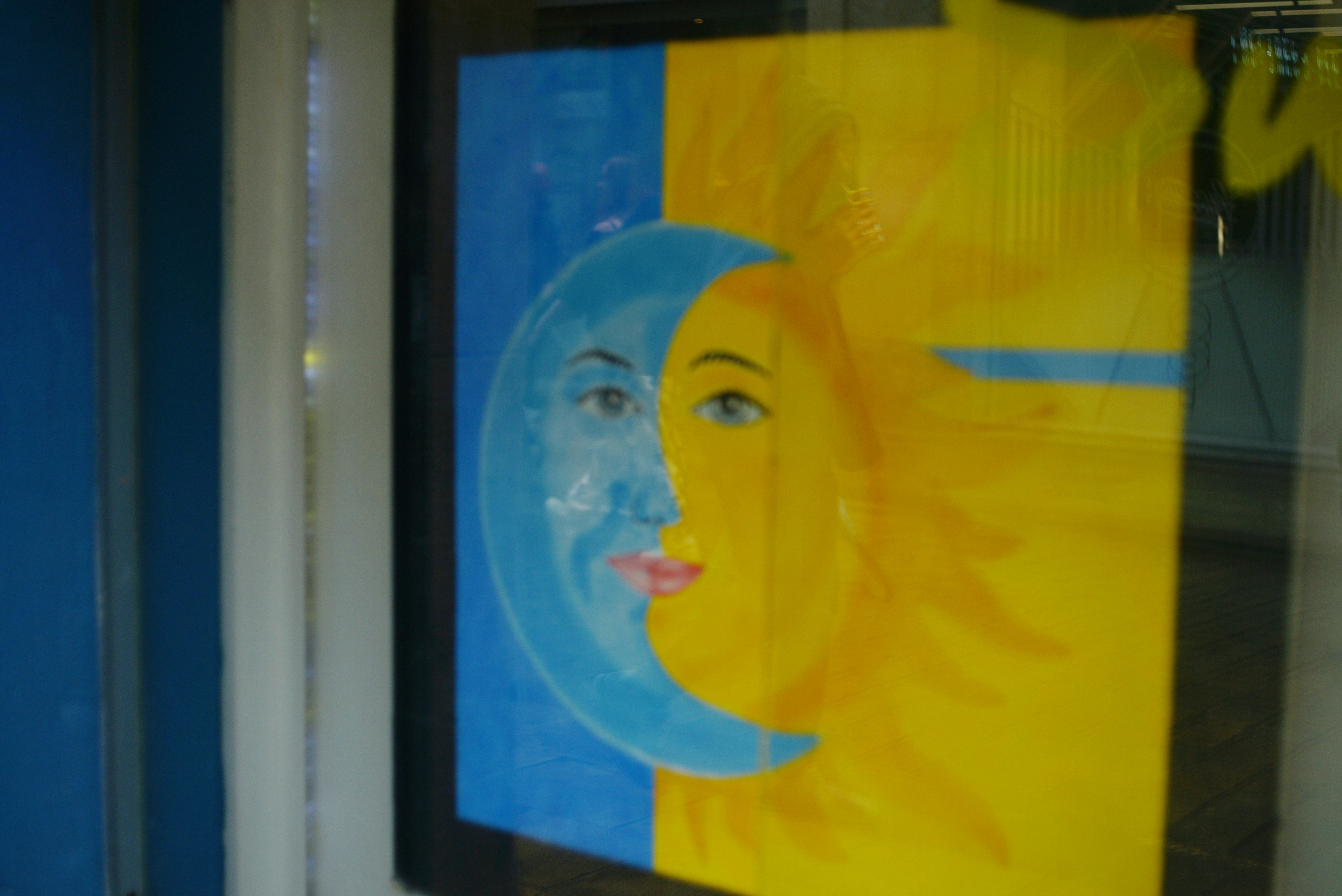 Dual-Wace of Day and Night: Sun-Moon Portrait in a Shop Window