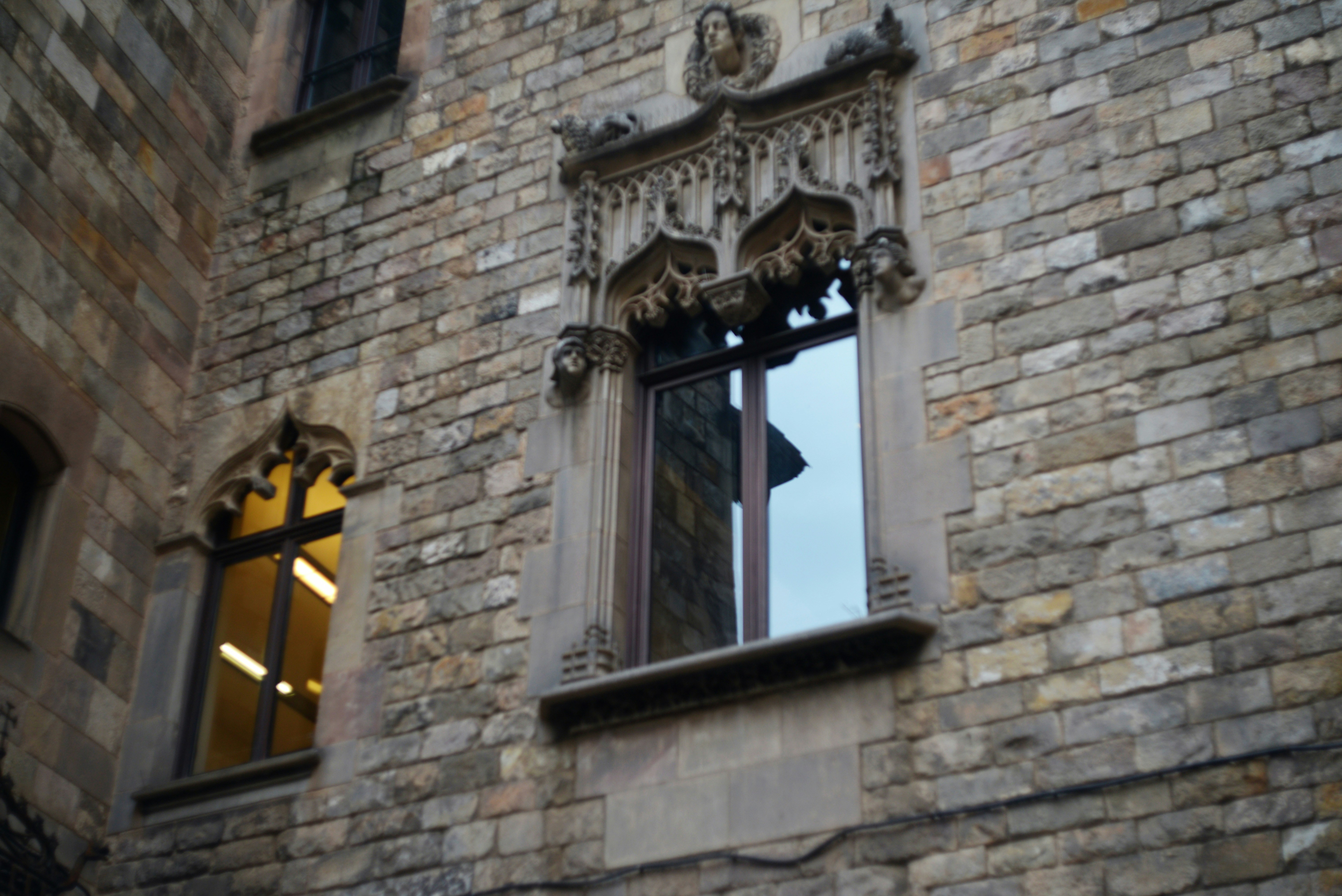 Arched Window Gable on a Weathered Stone Facade