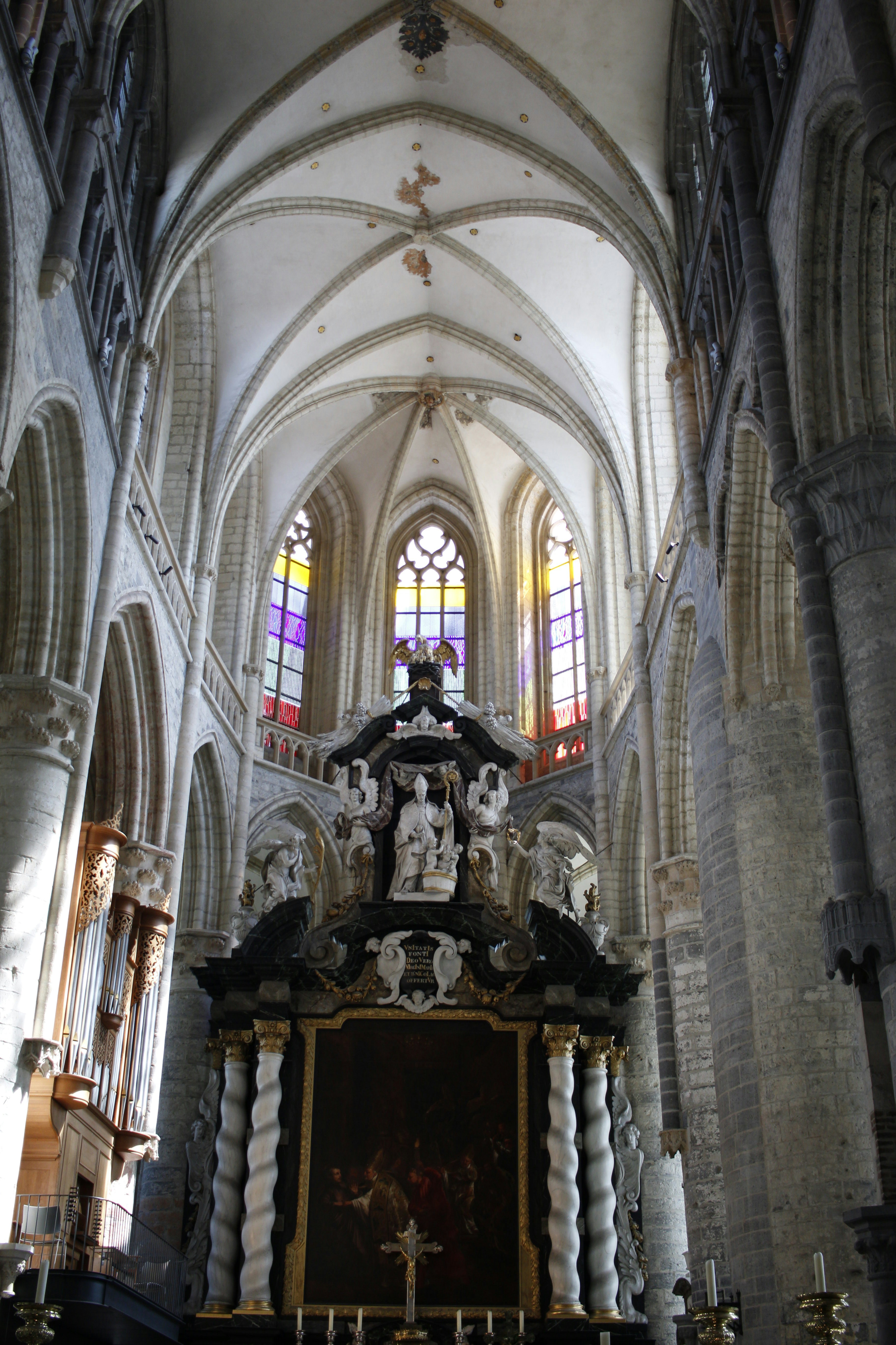 Gothic Cathedral Nave with Ornate Altar Framing the Light