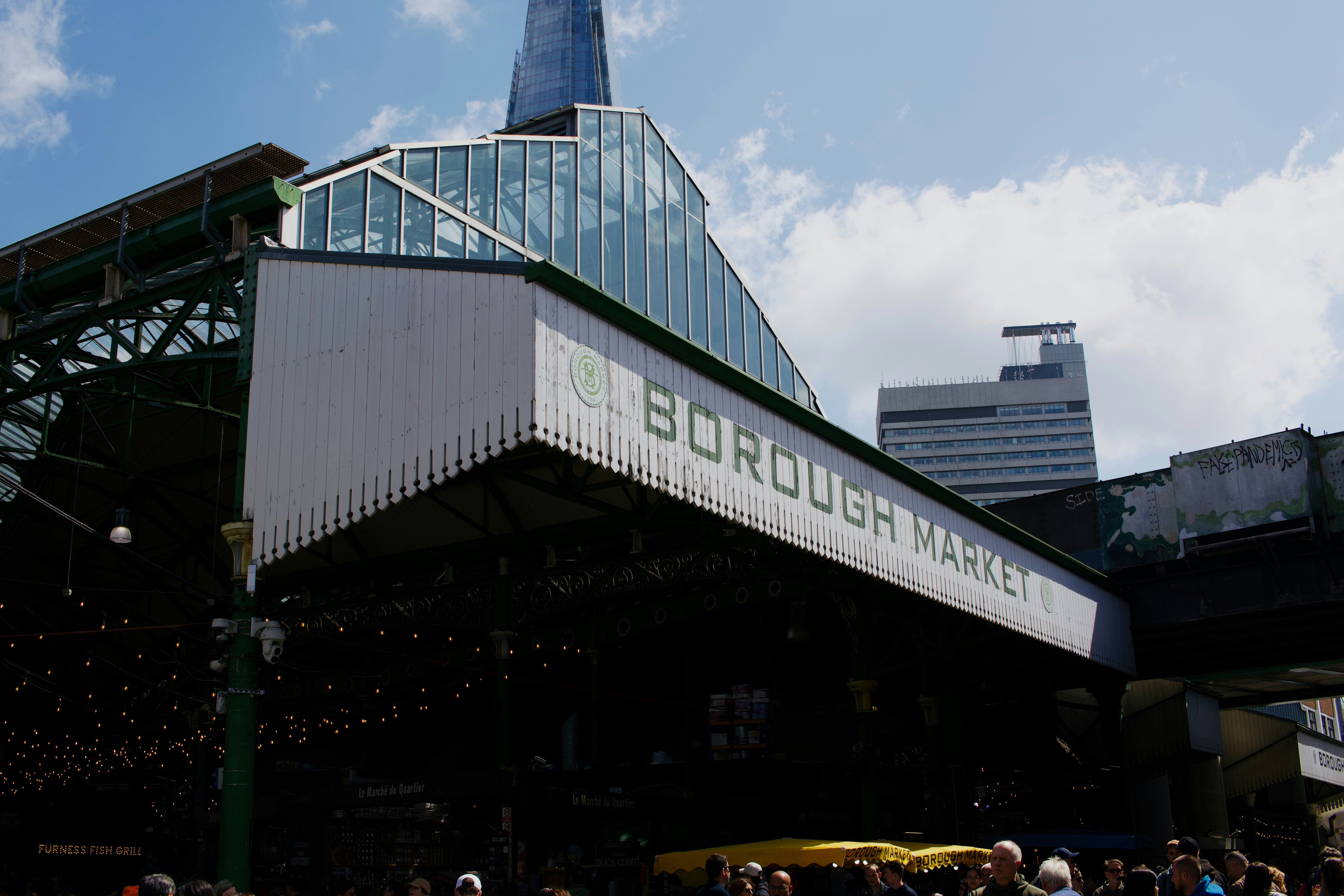 Market Entrance under Glass Canopy: Borough Vibe at Dusk