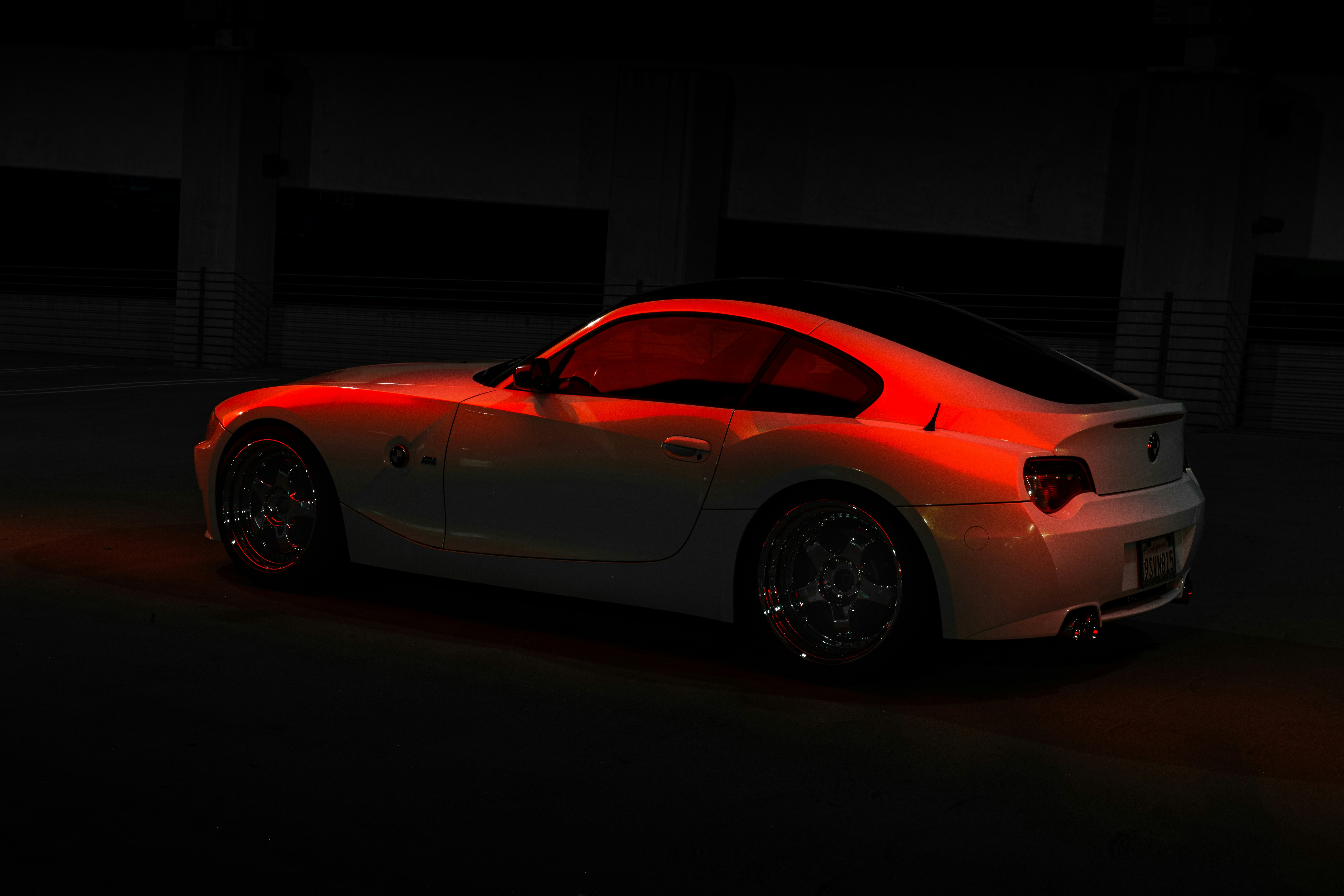 Low-Key Red Pulse: A Porsche-Styled Coupé in Dim Ambient Light