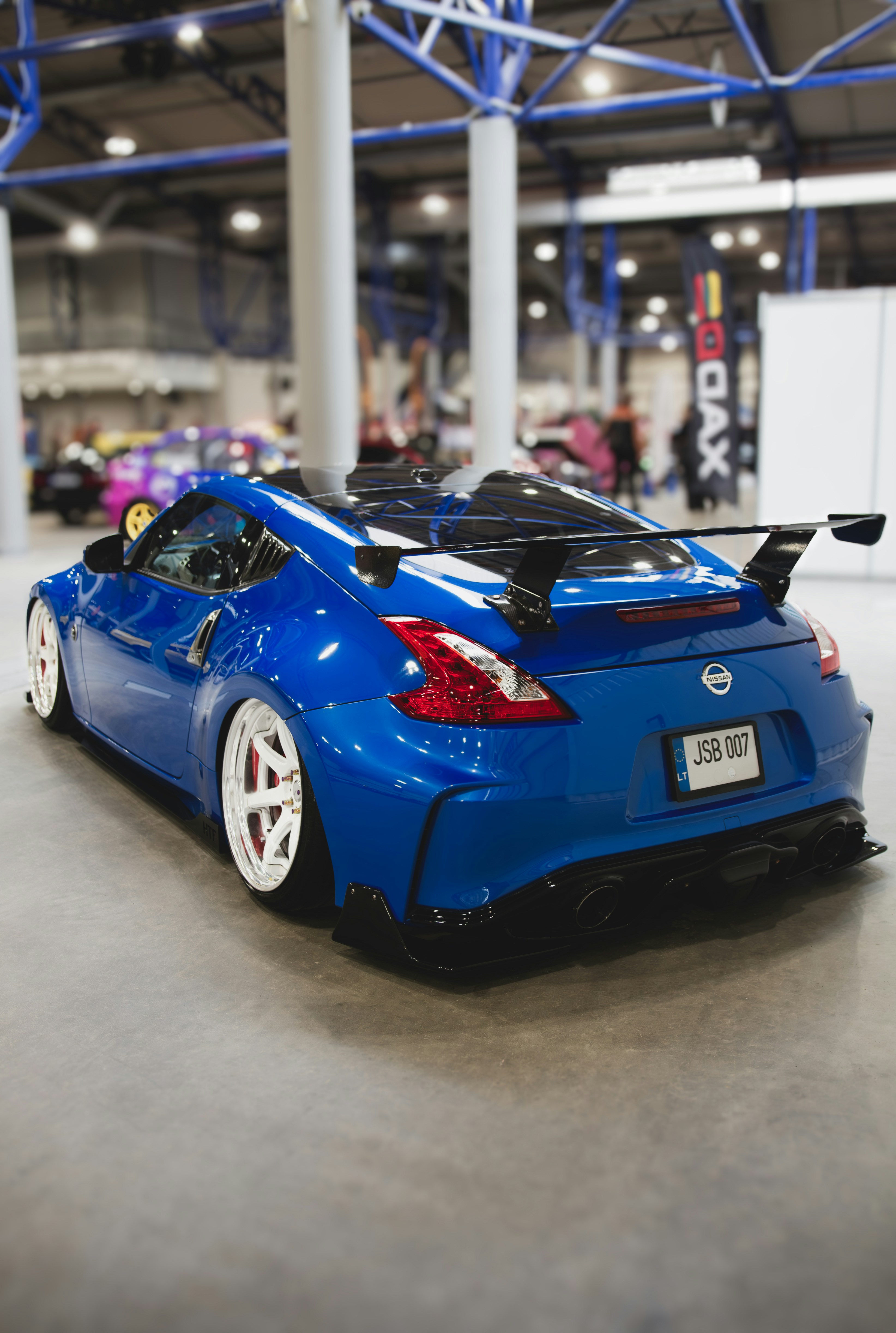 Blue Nissan Silhouette: A Showcar in Focus at an Indoor Exhibit