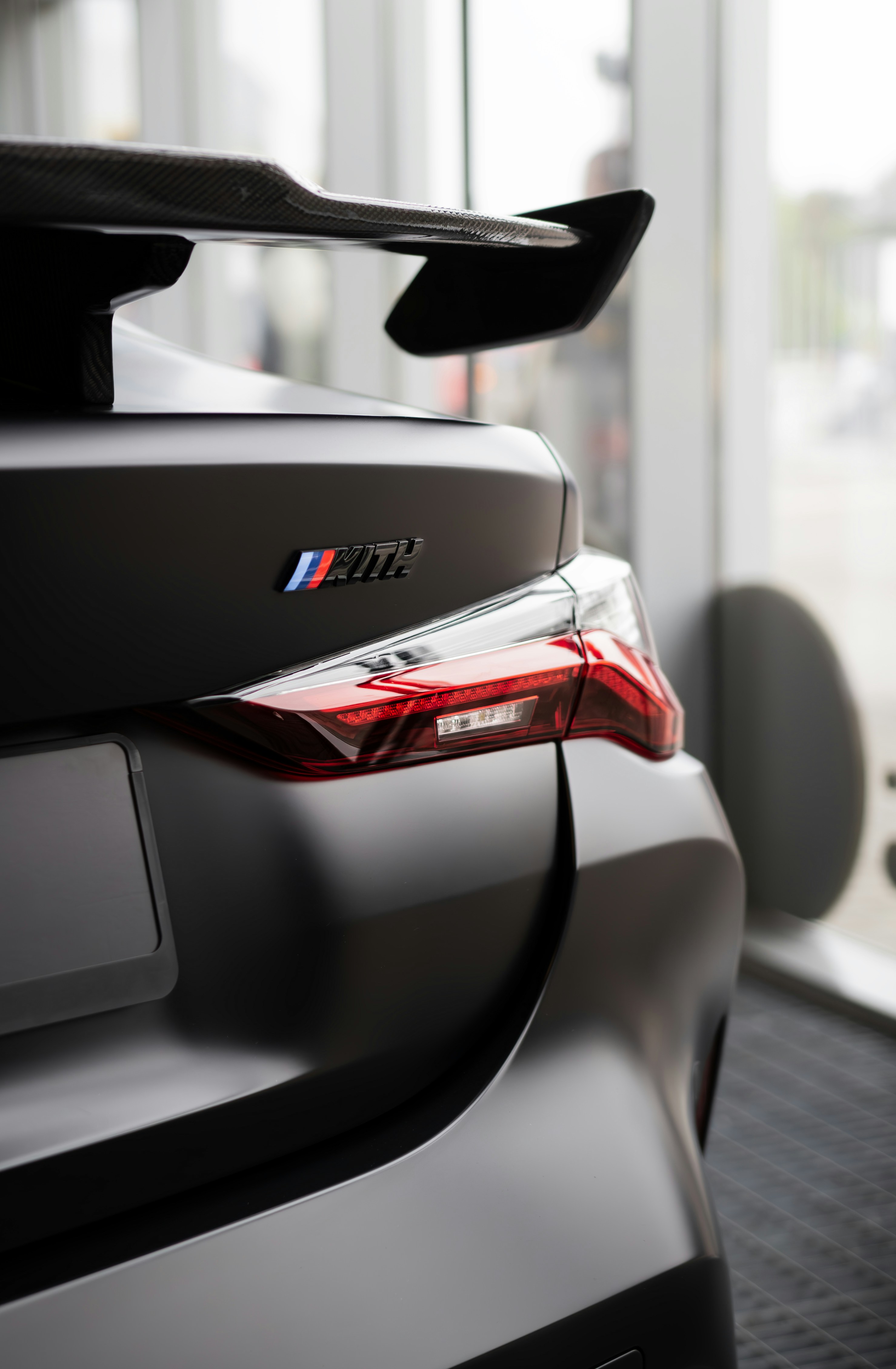 Rear View of a Performance BMW M Division Car with Carbon Spoiler