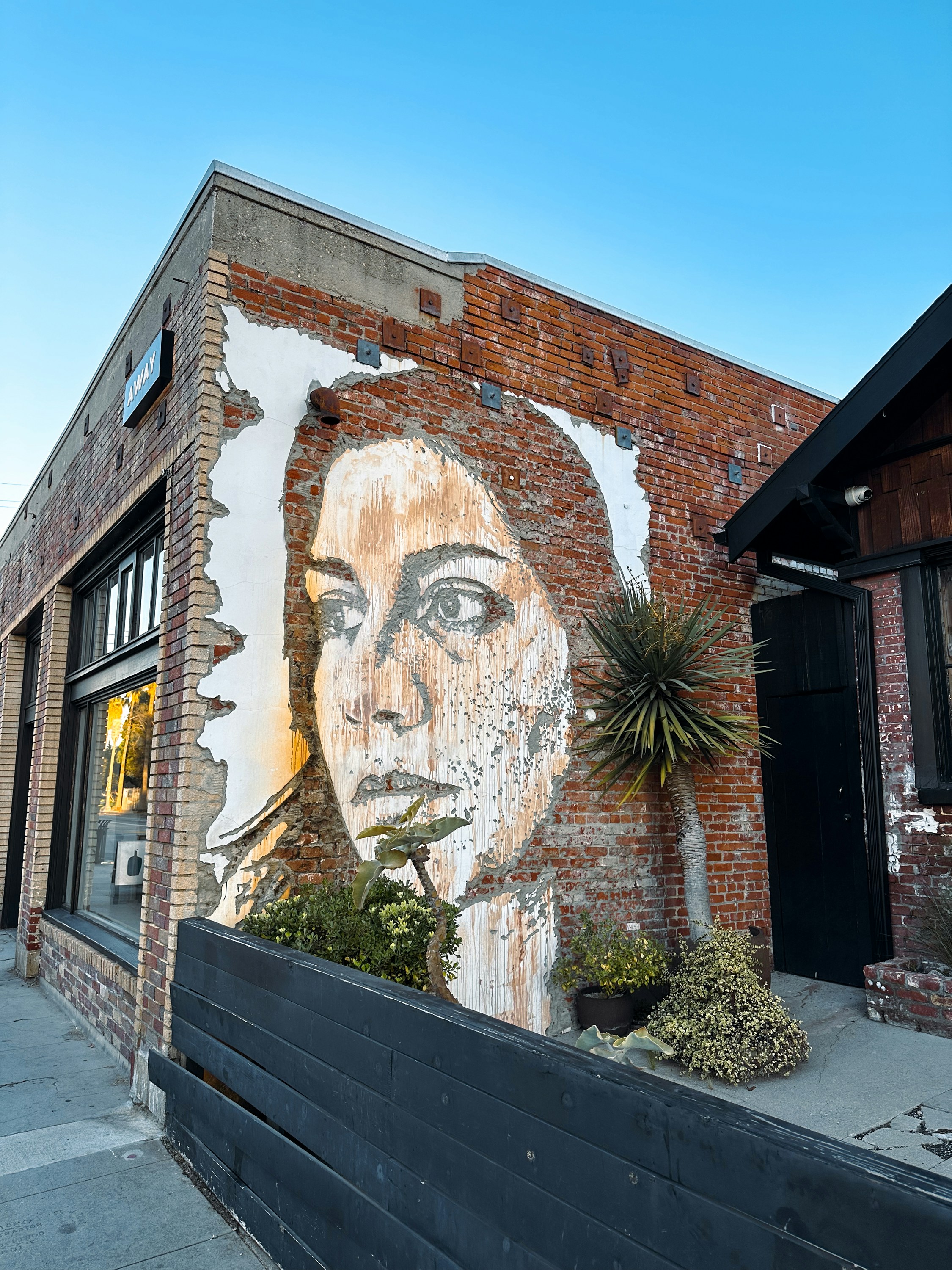 Brick Wall Portrait: Street Art Meets Urban Texture