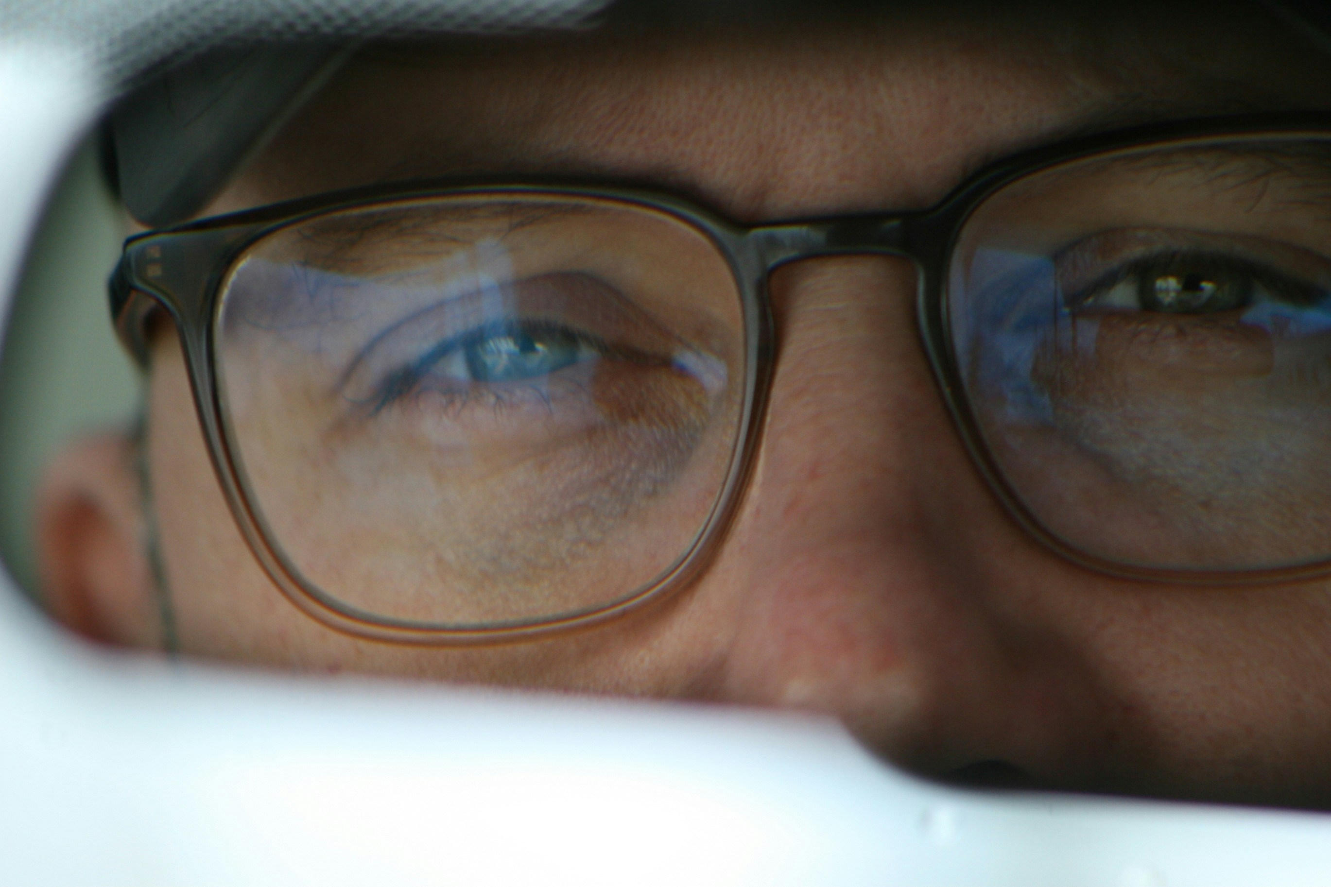 Close-up of Resolute Gaze Through Glasses