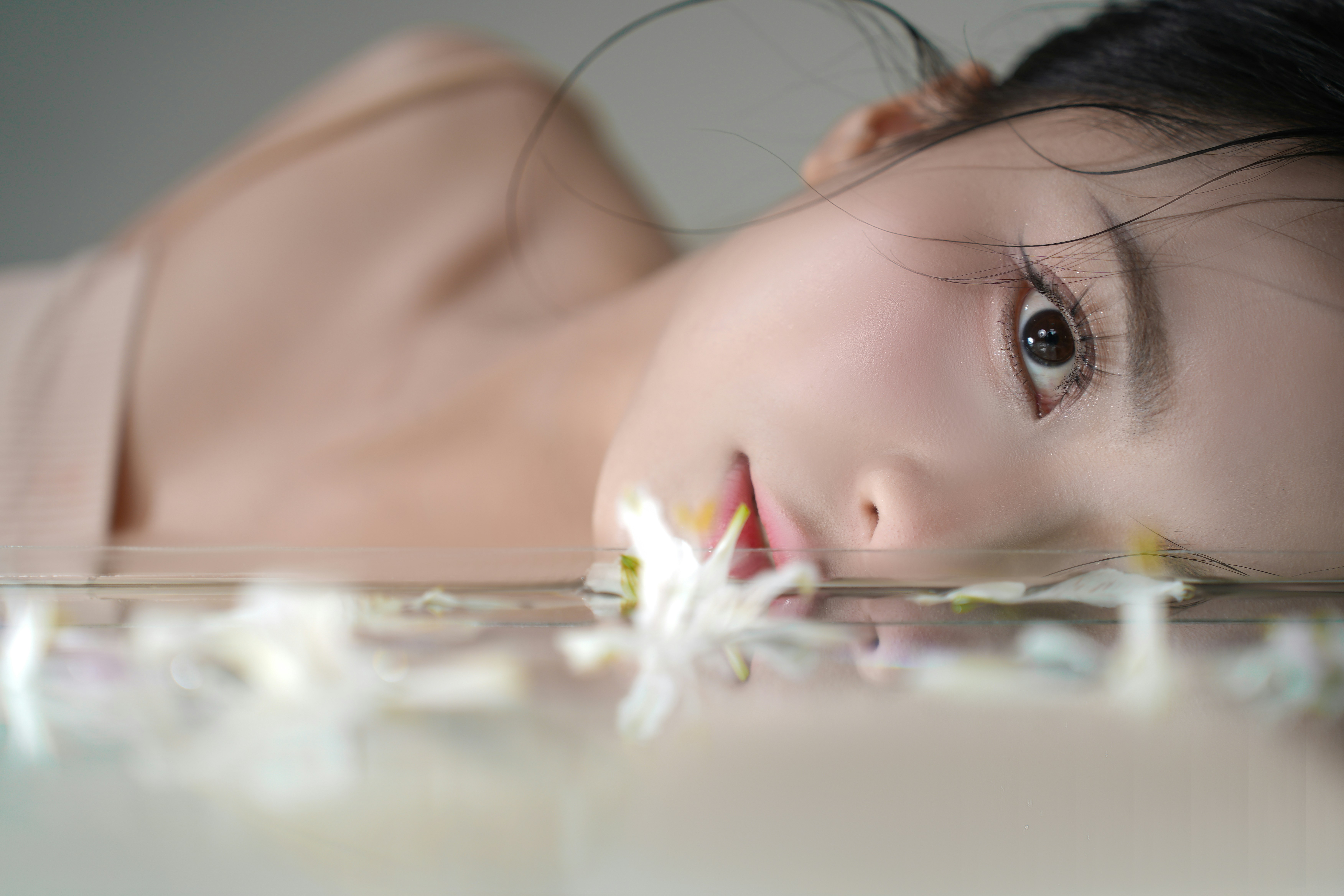 Soft Focus Portrait: A Quiet Moment with Flowers