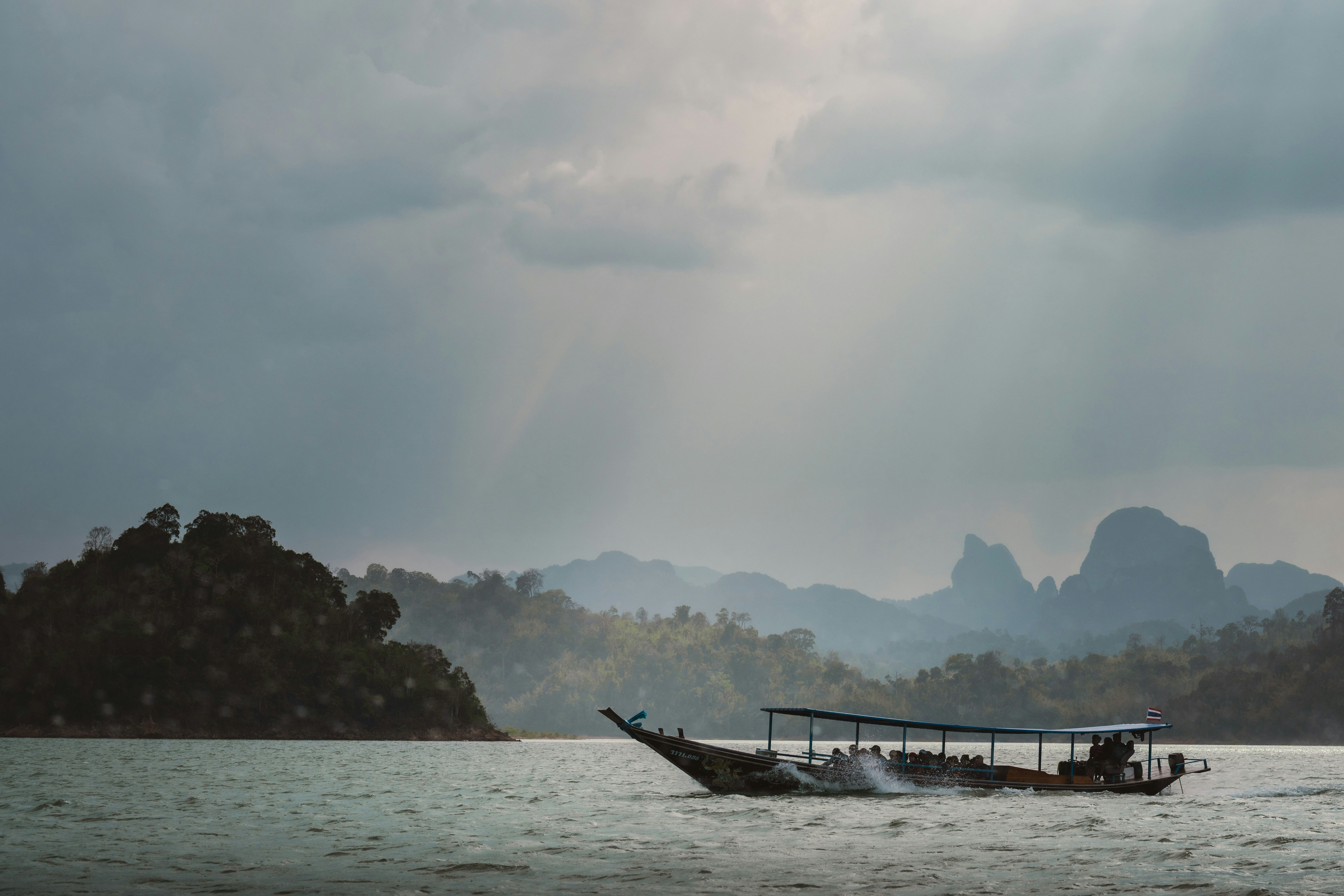 Moonlit River Passage: A Lone Boat Crowned by Soft Dusk