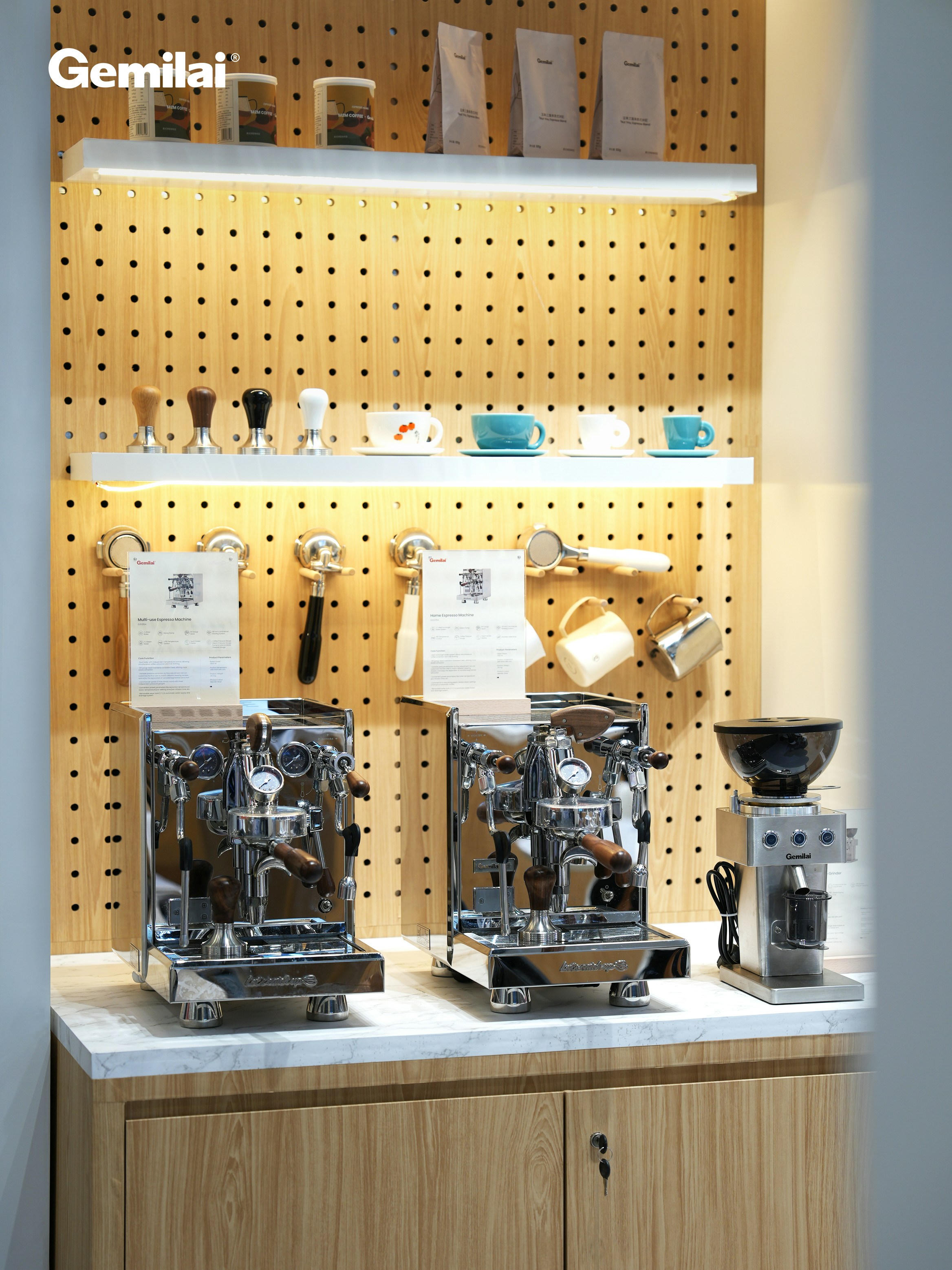 Studio Café Duo: A Row of Espresso Machines Beneath a Pegboard Wall